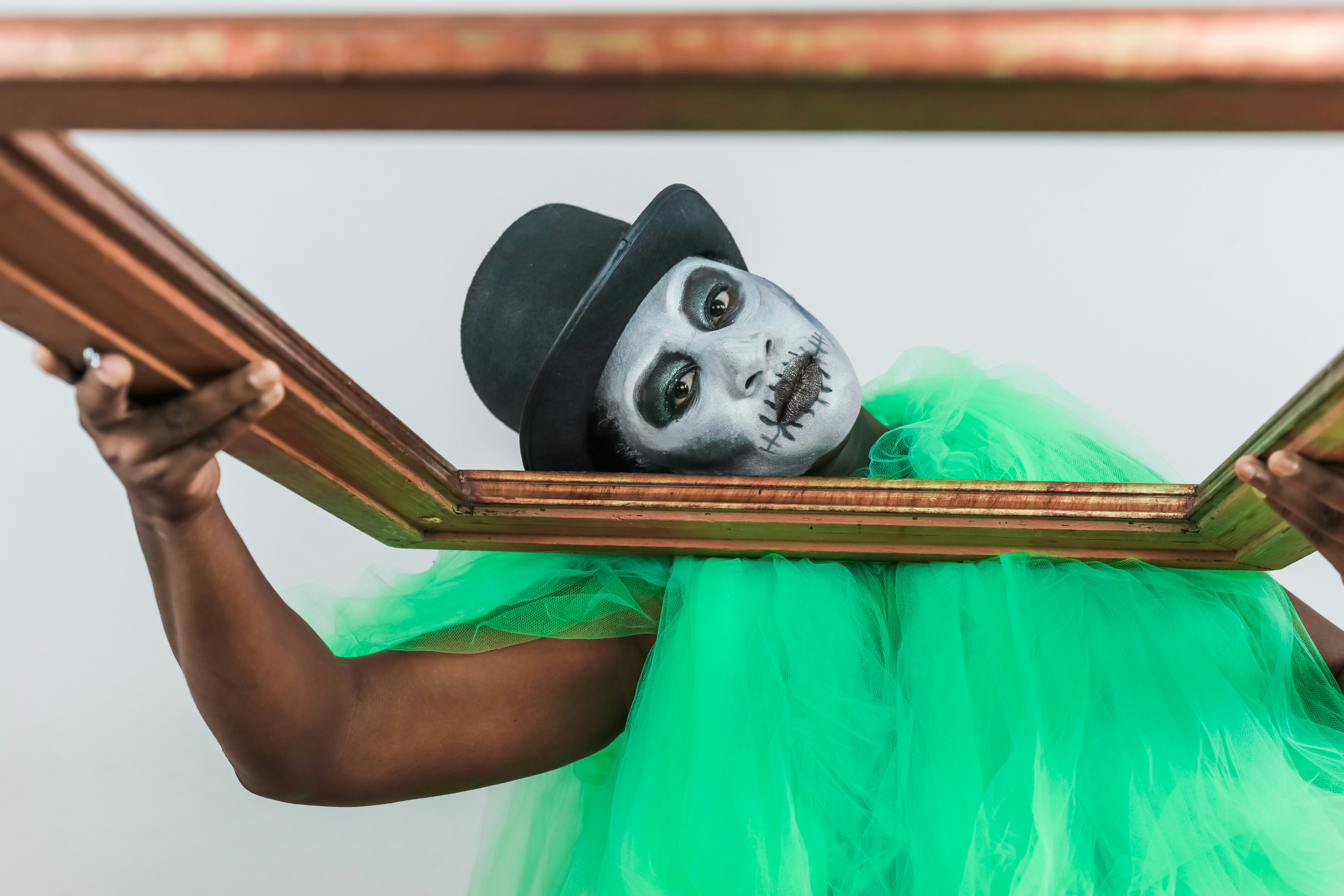Ghoulish Glimpse: A Green Veil and a Painted Smile