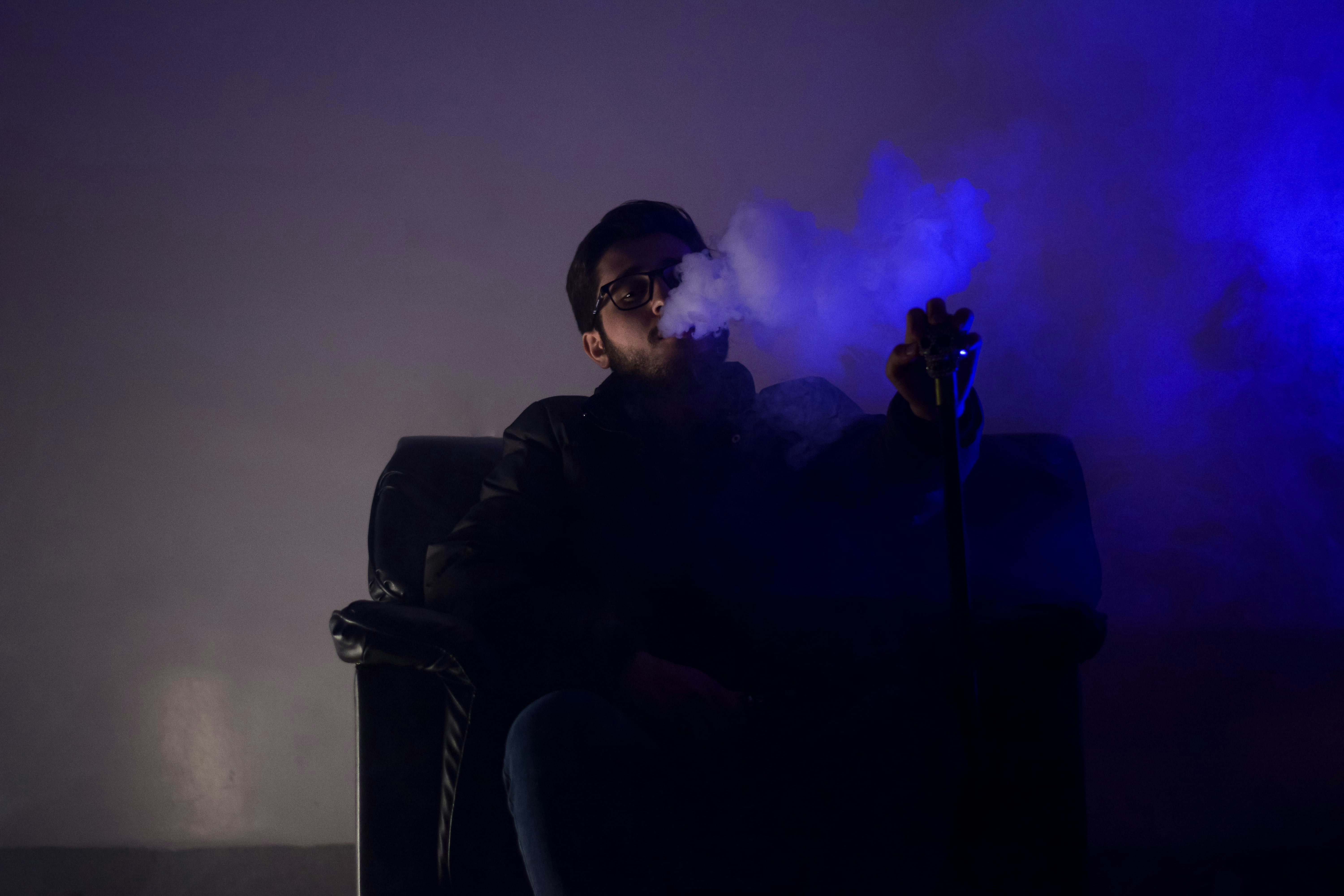 A person vapes, surrounded by dark atmosphere. photo – Free Wallpaper ...