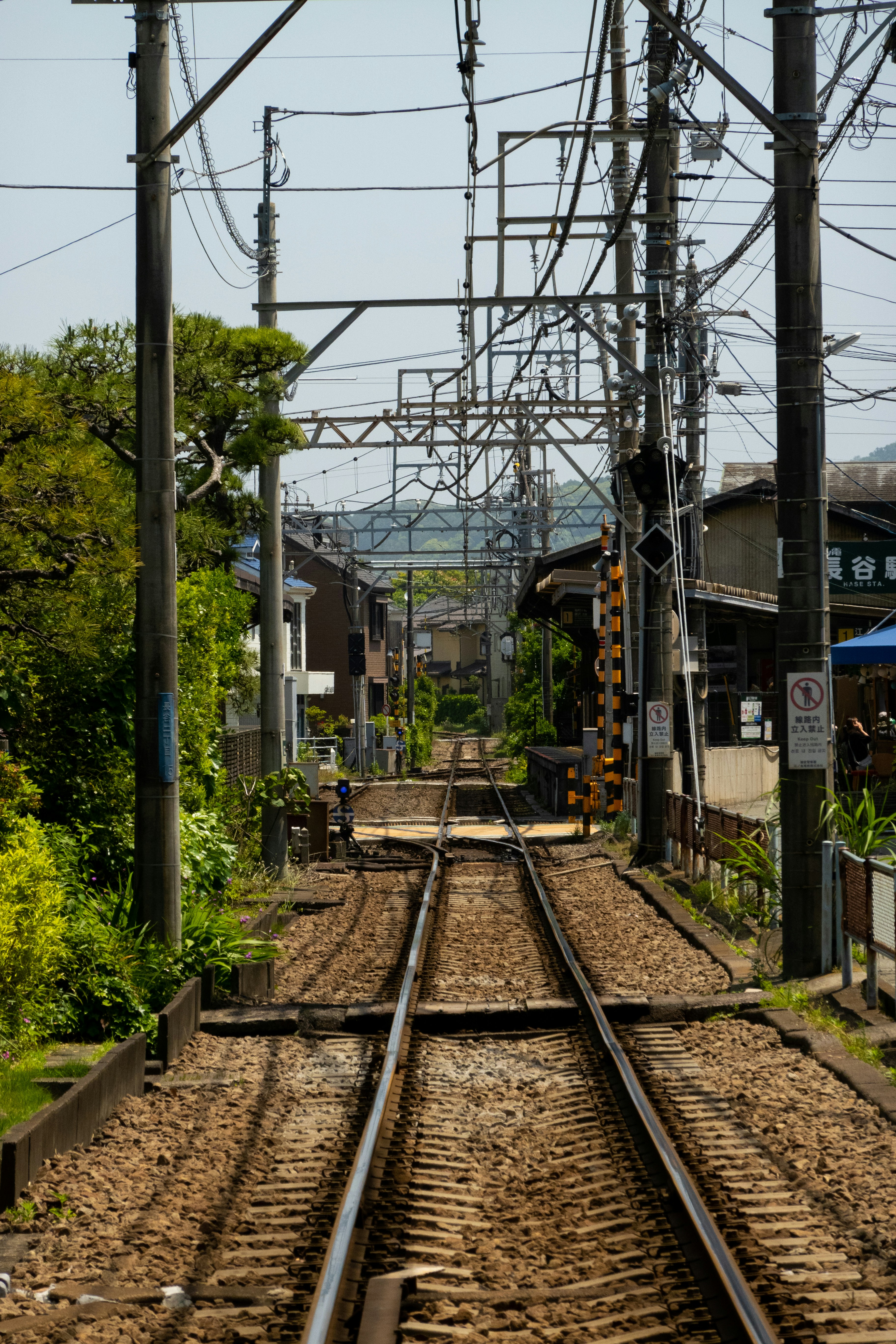 Kamakura 2025 | Railway tracks stretch towards a distant residential area.