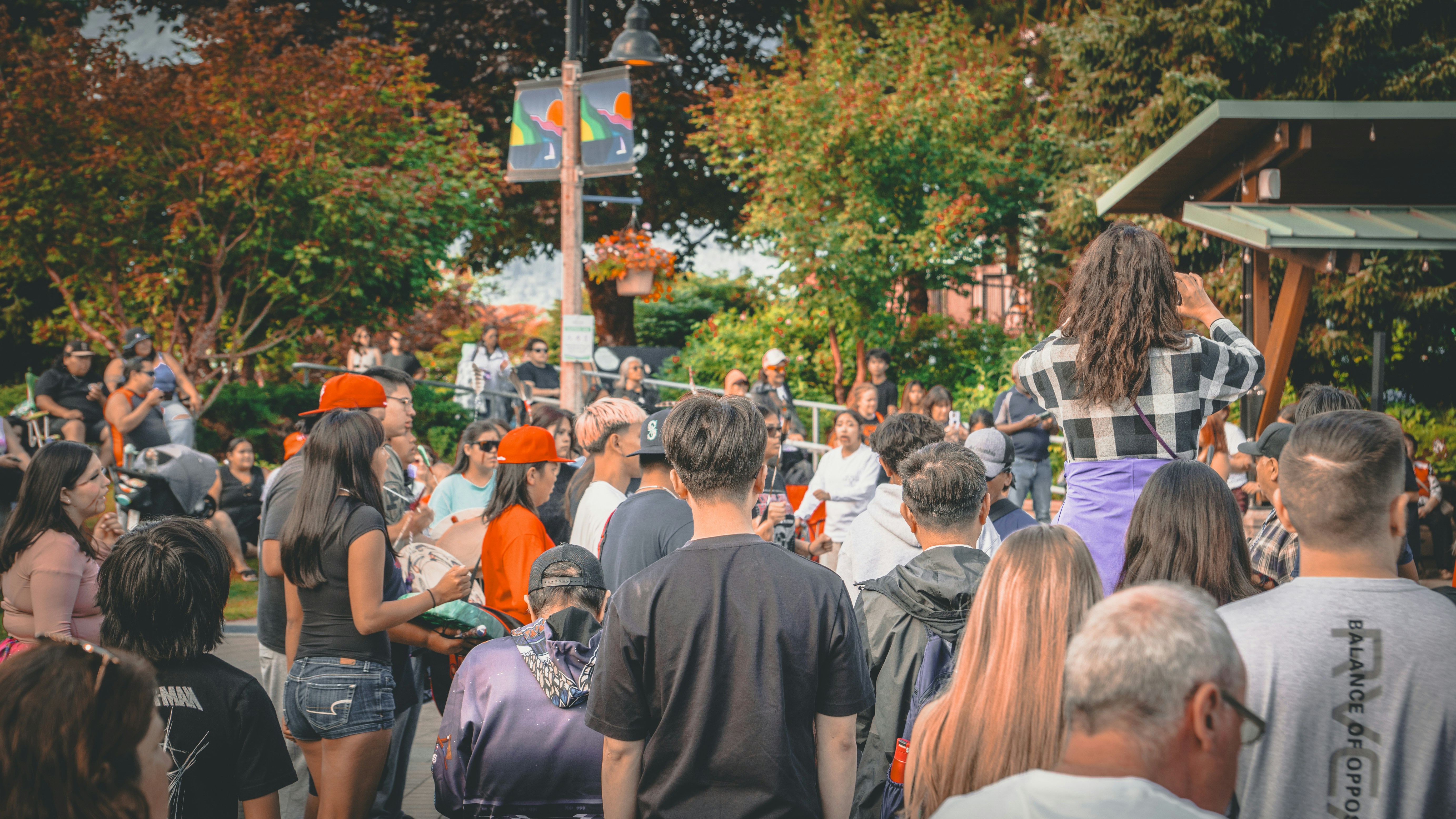 Crowd on an outdoor campus plaza during a fall event