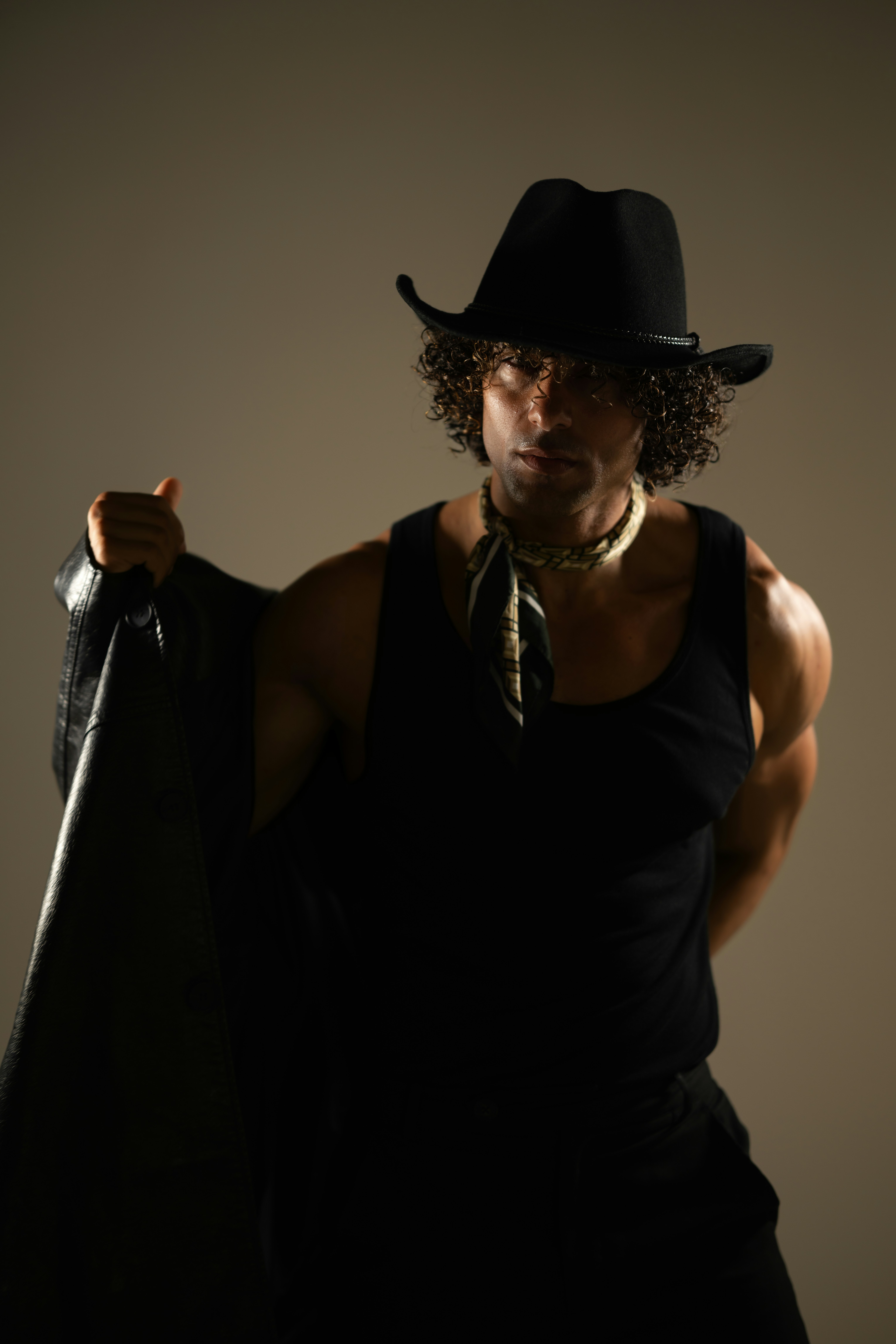 A muscular man poses in a cowboy hat. photo – Free Dark aesthetic Image ...