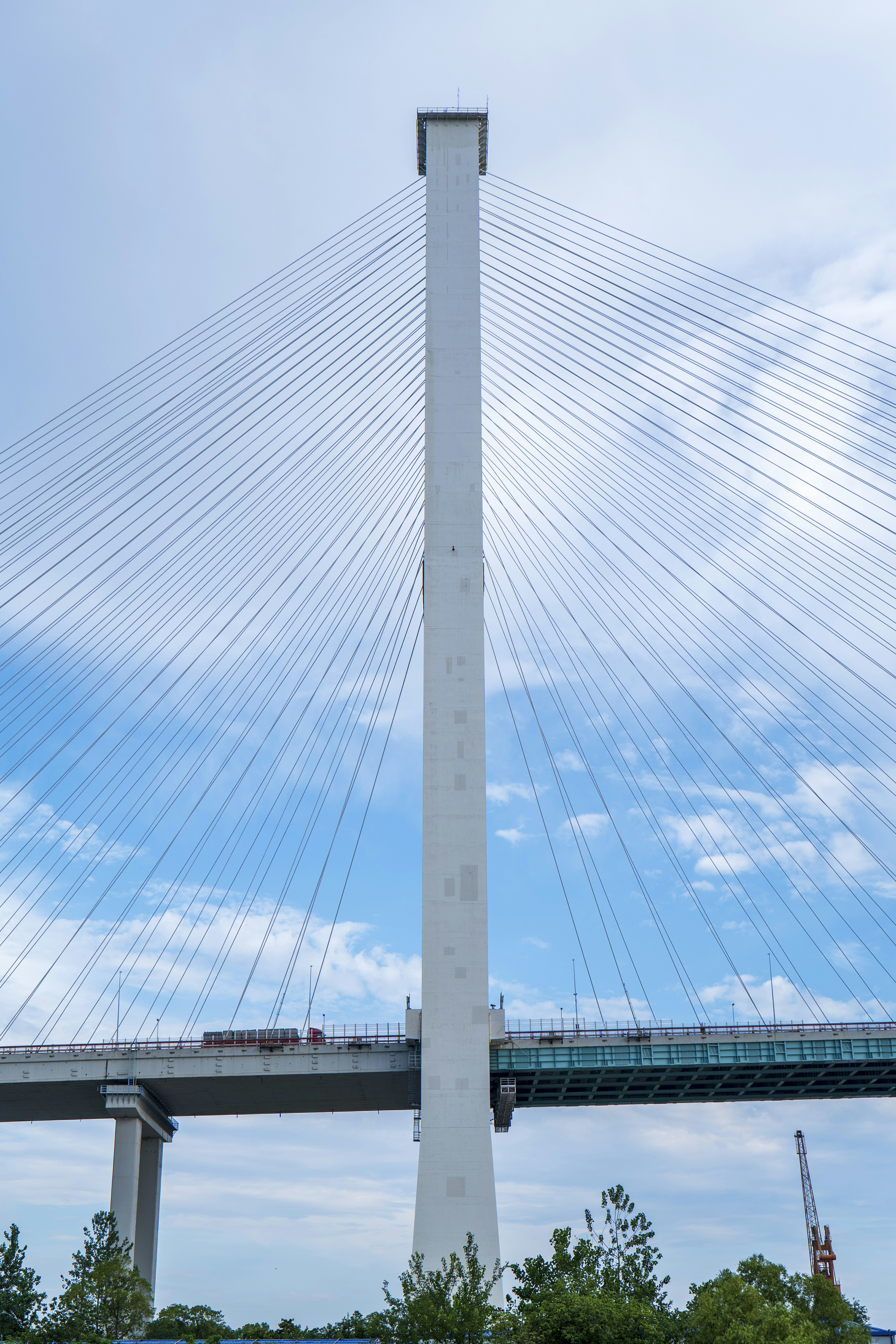A tall bridge tower reaches towards the sky.