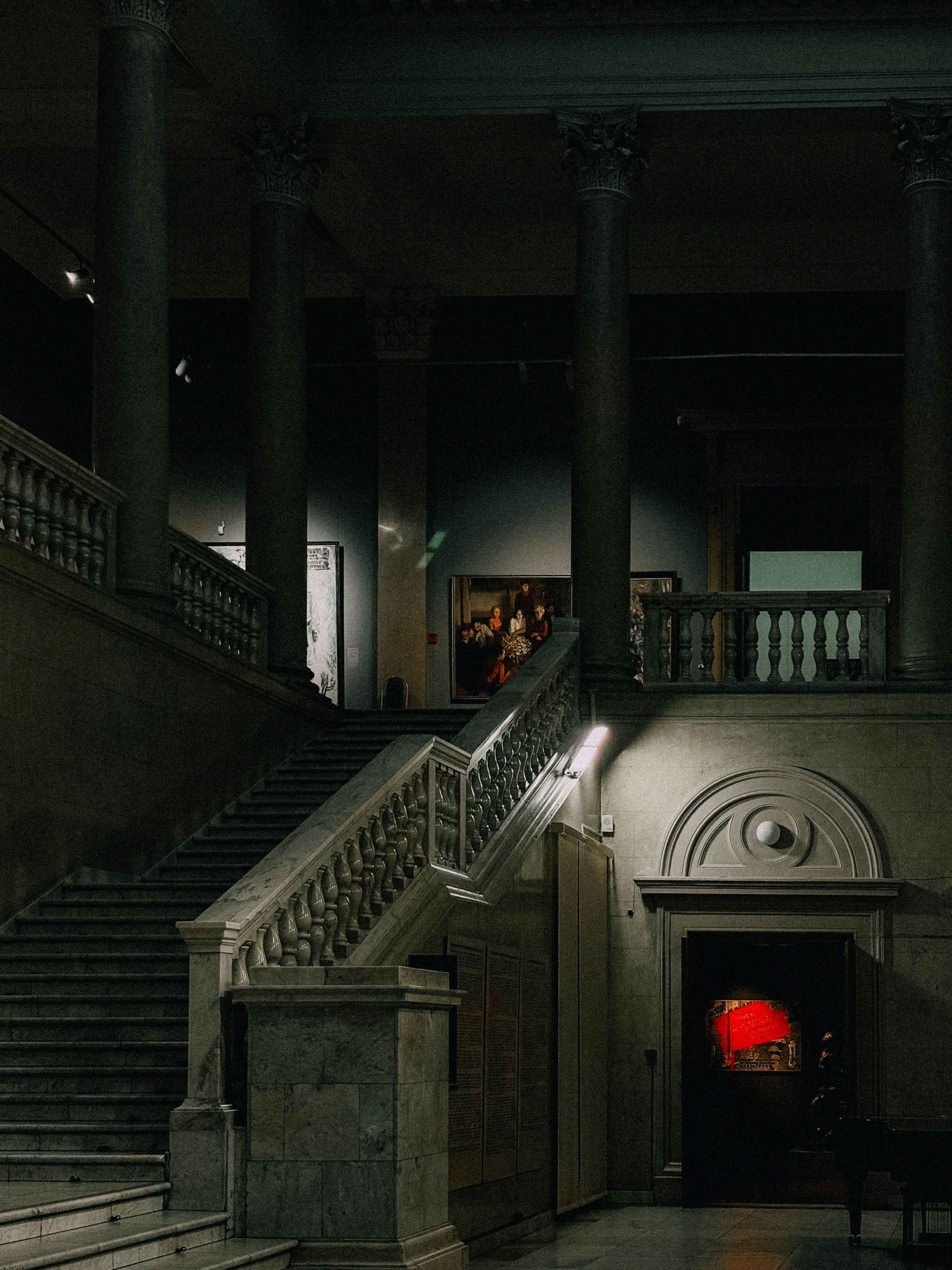 Minsk | An ornate staircase leads into a dark building.