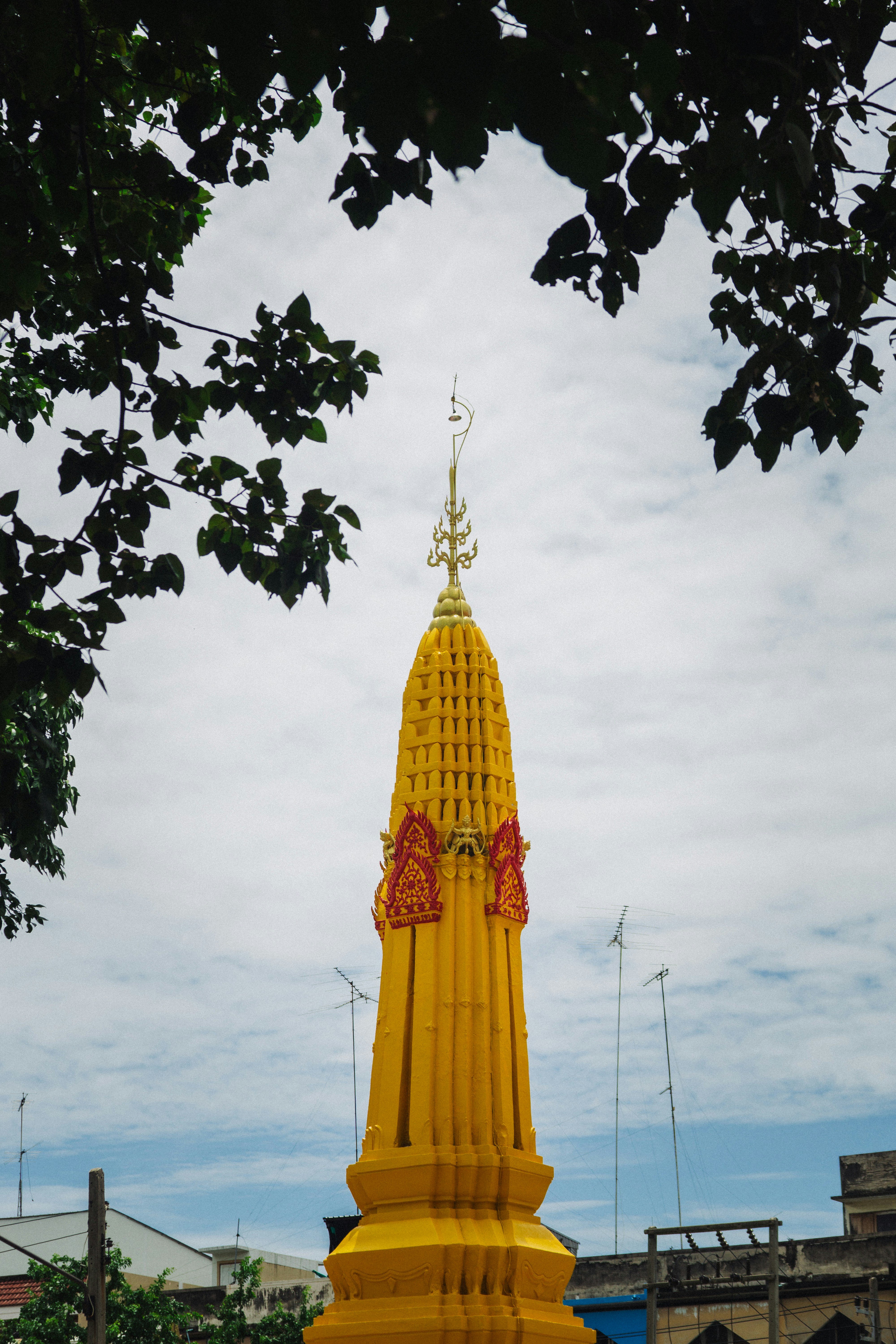 Golden Spire Amidst a Canopy of Green