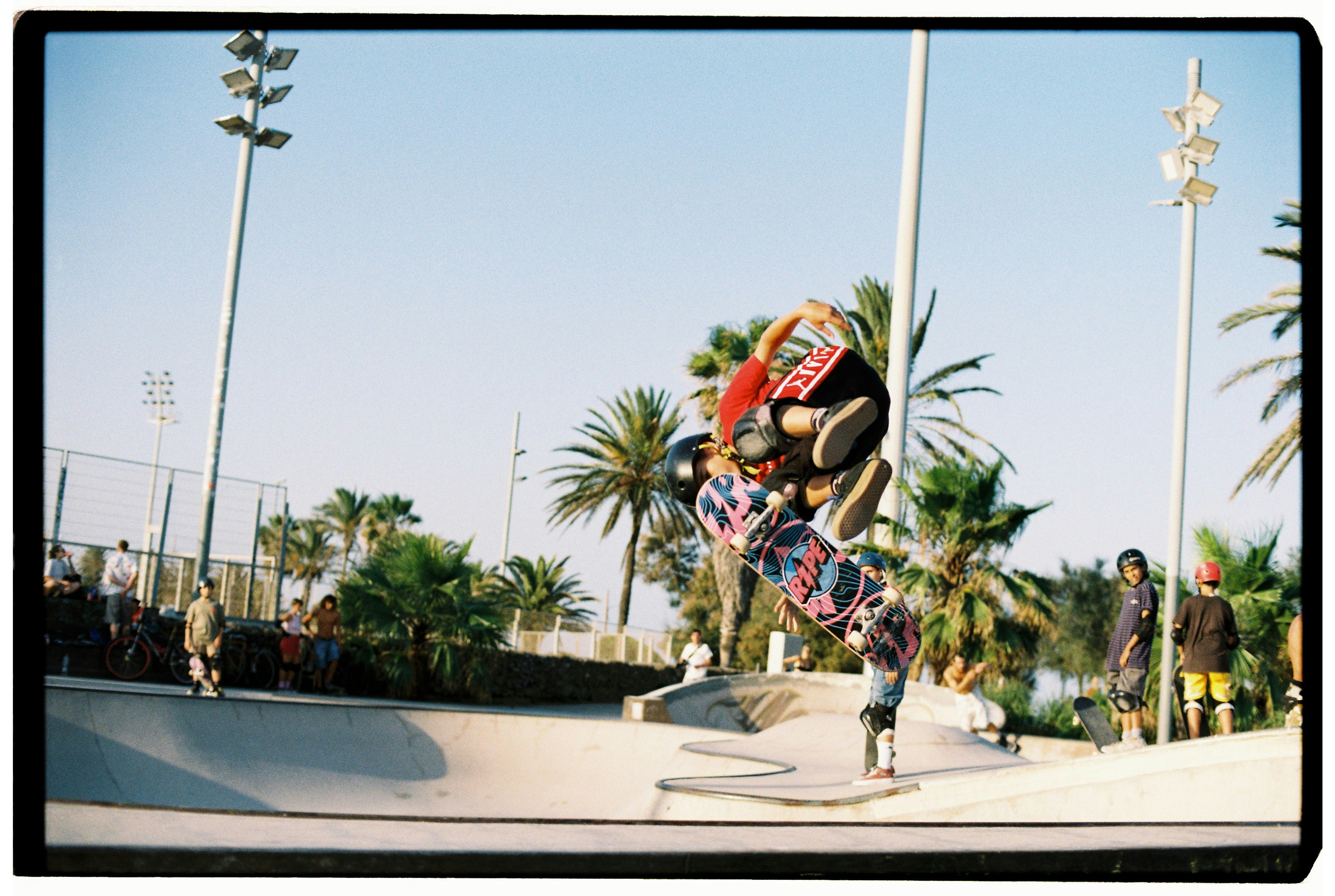 Mid‑Air Flip: Skateboarder Carves a Arc Over the Concrete Bowl
