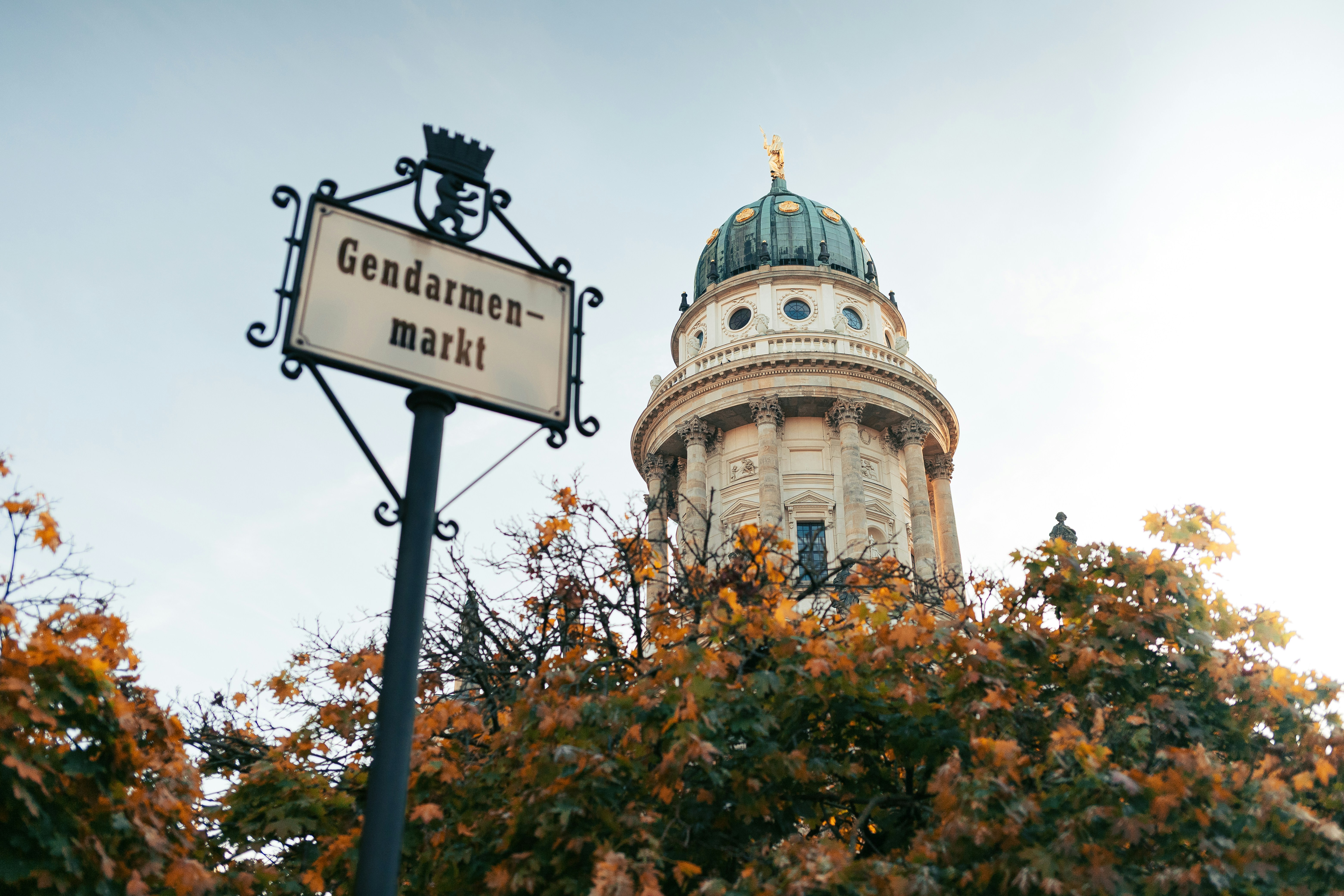 Gendarmenmarkt Signpost Framed by Berlin Dome in Autumn Light
