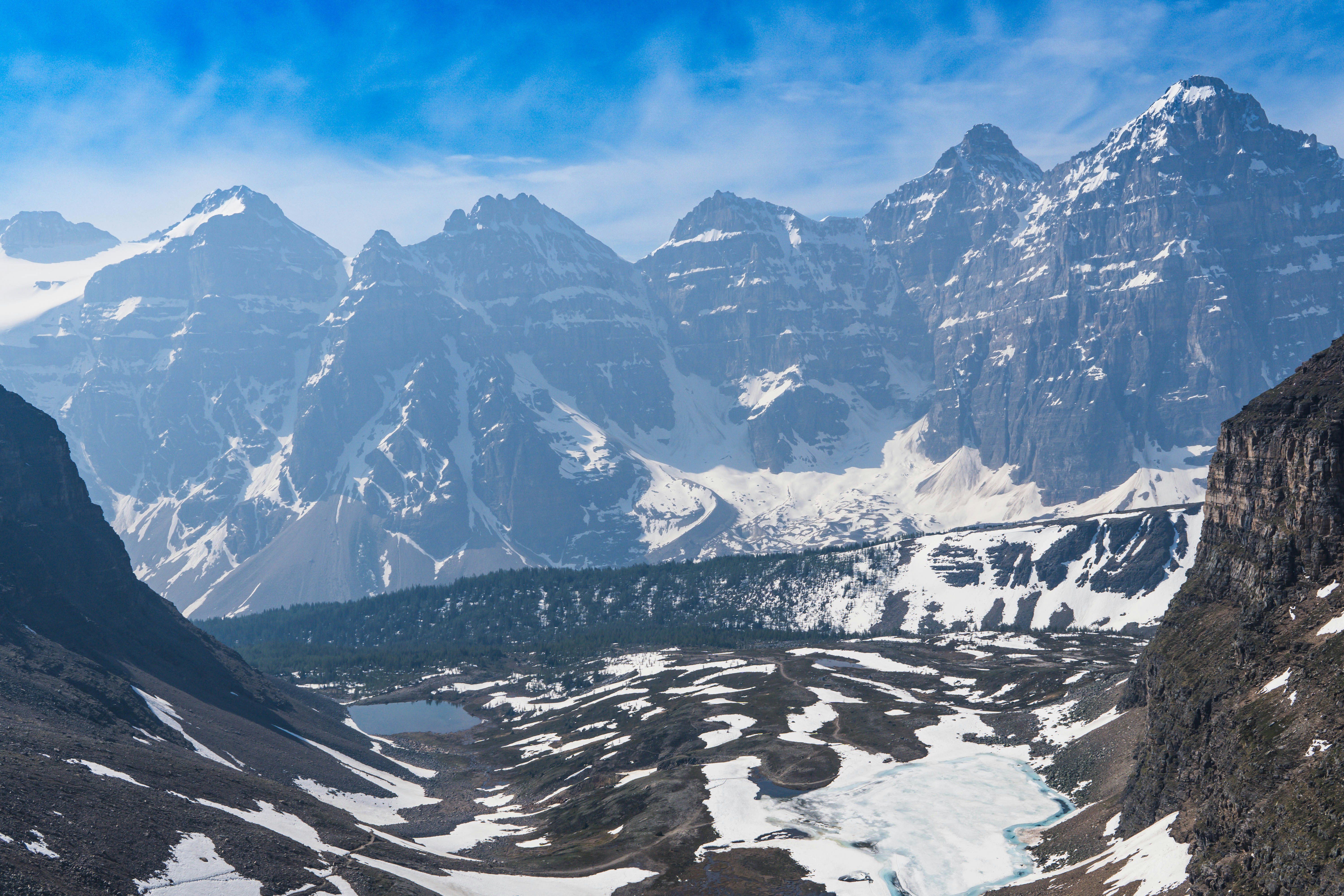 Majestic snow-capped mountains rise in the distance.