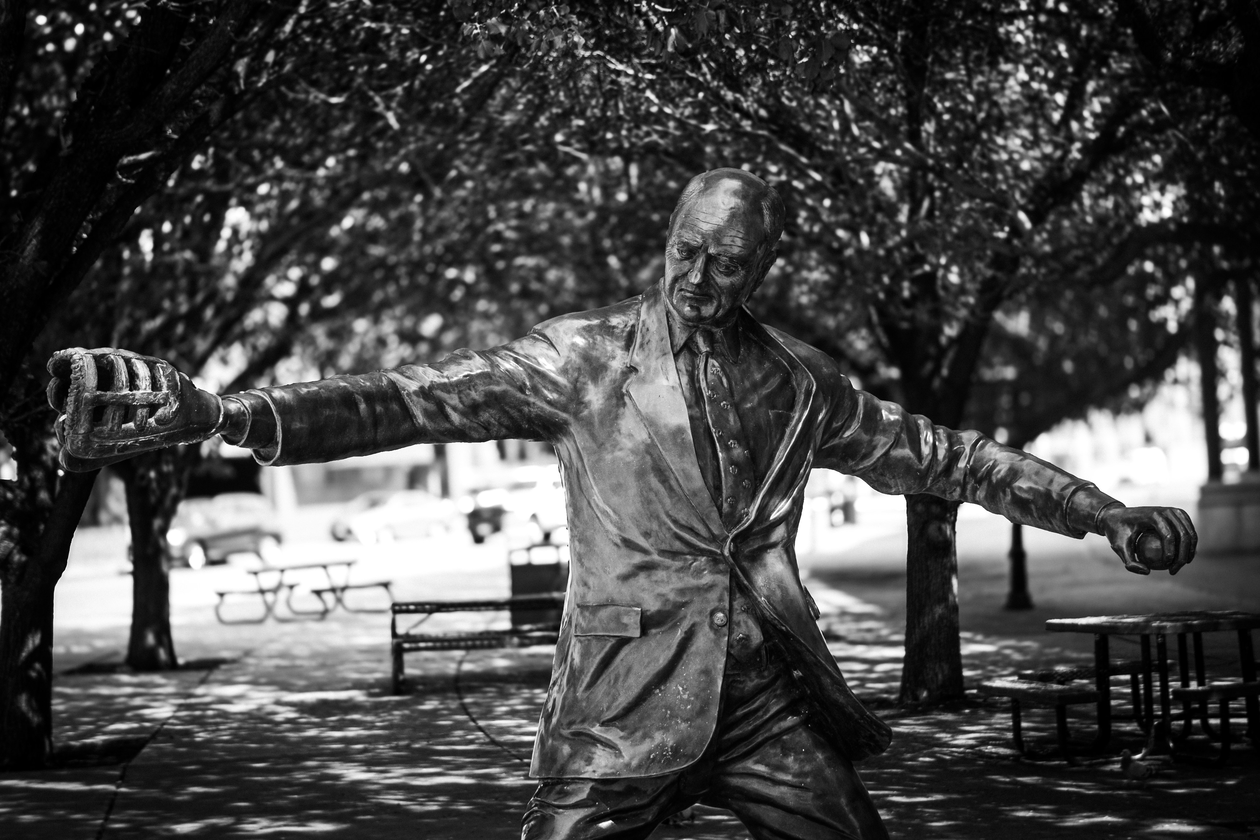 A statue of a man reaching out.
