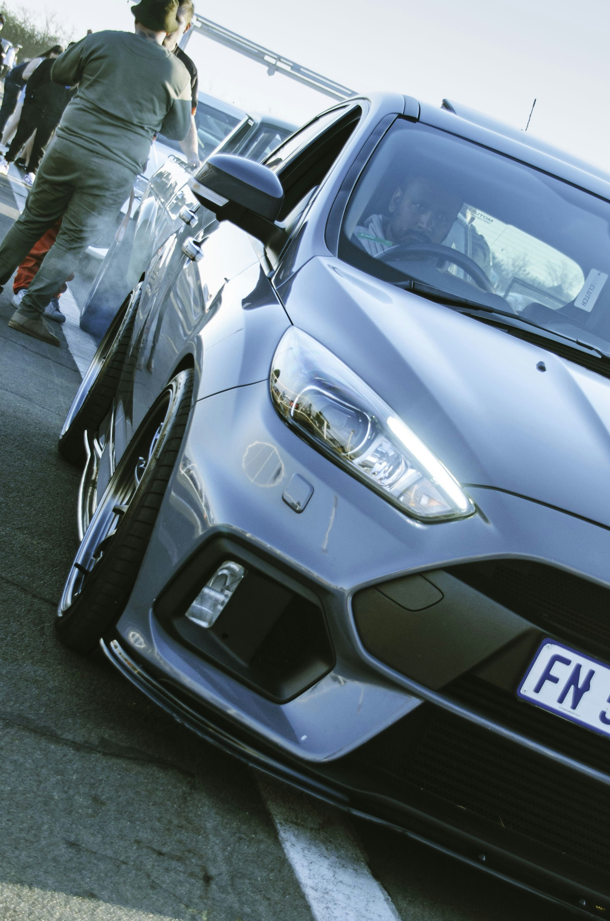 Cerulean Mercedes-Benz: Front-end at a bustling car meet