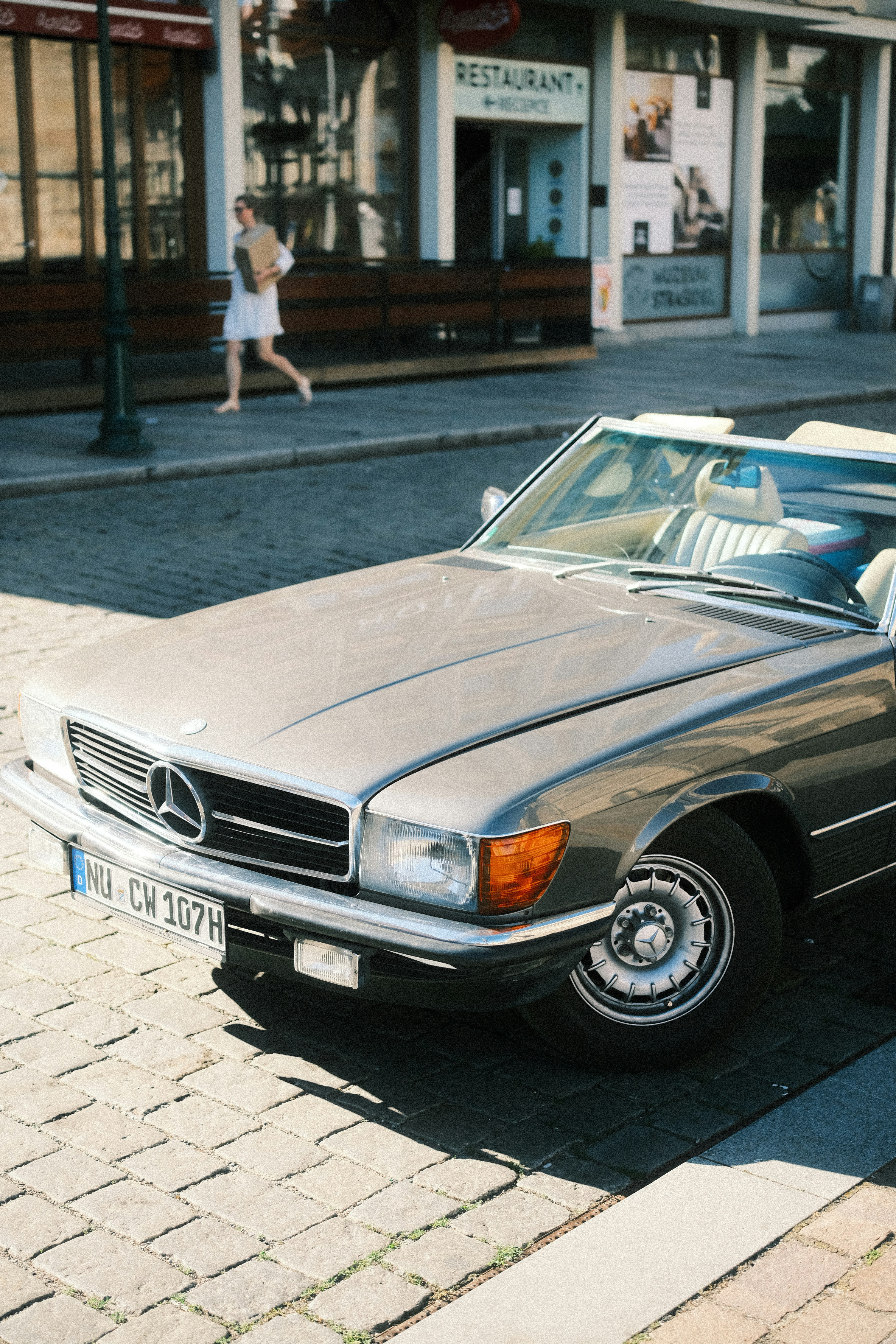 A classic mercedes convertible is parked on a city street. photo – Free ...