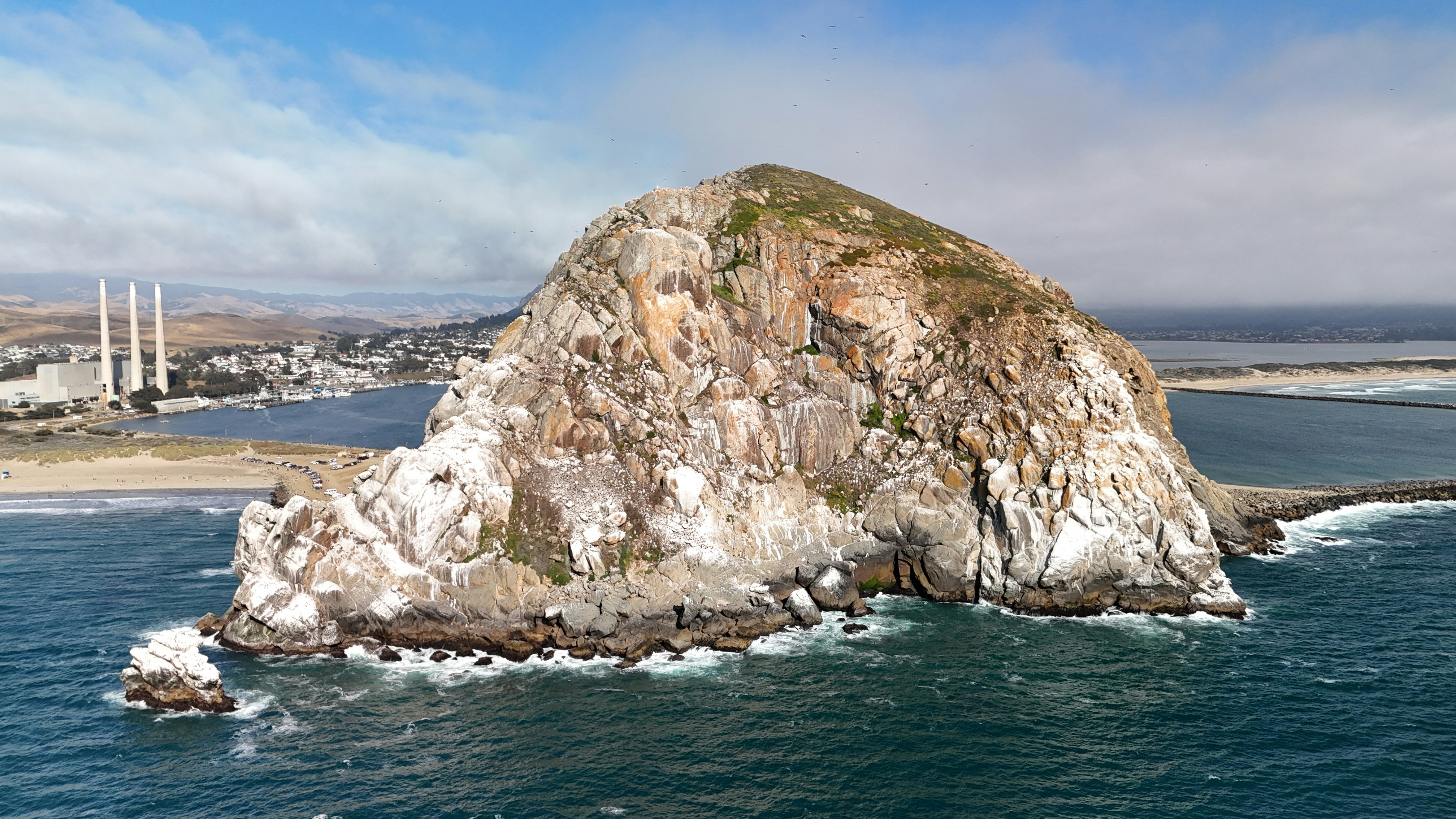 Granite Sentinel: Rugged Isle Rising Against the Blue Atlantic