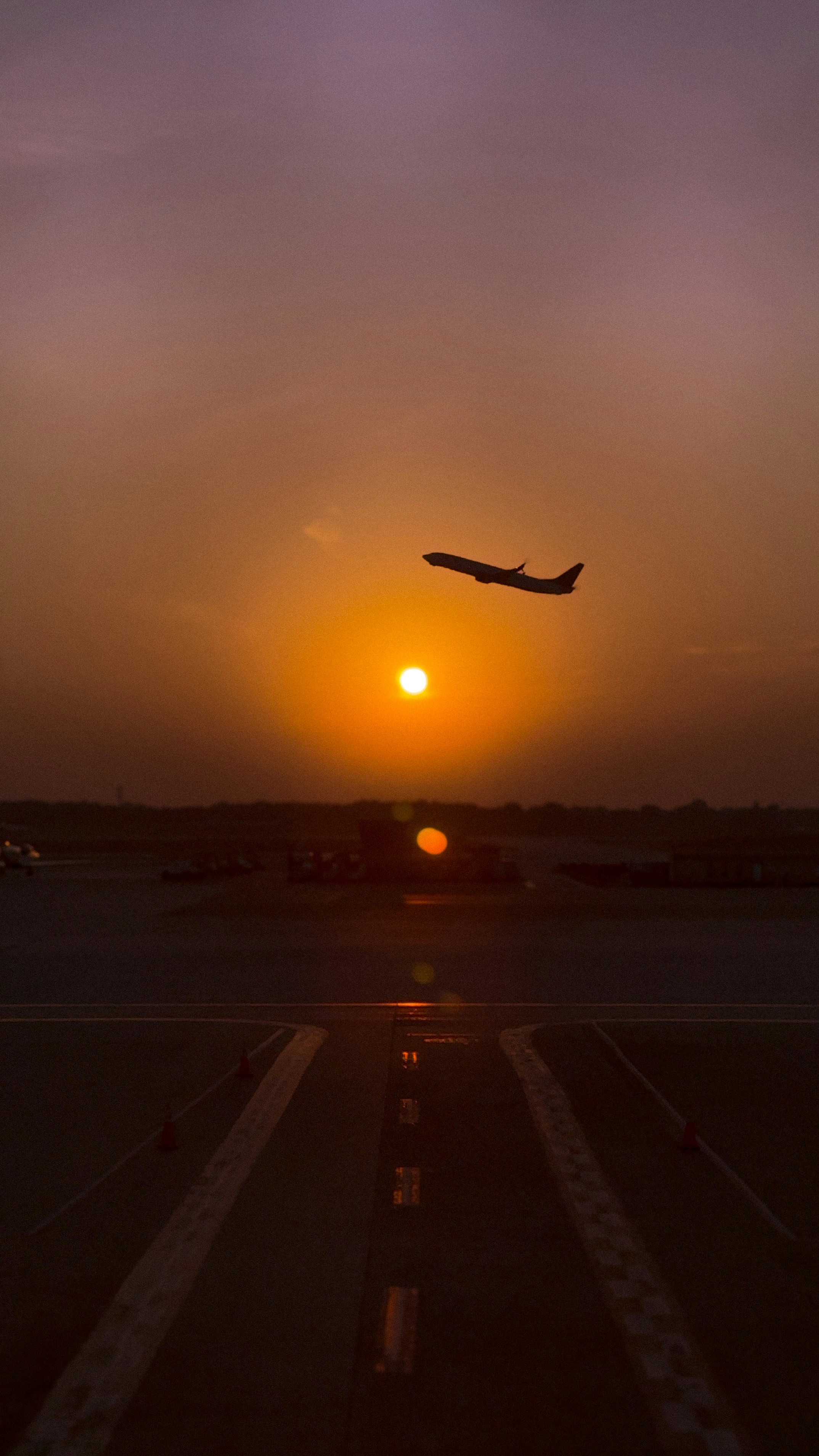 An airplane is taking off into a sunset. photo – Free Phone wallpaper ...