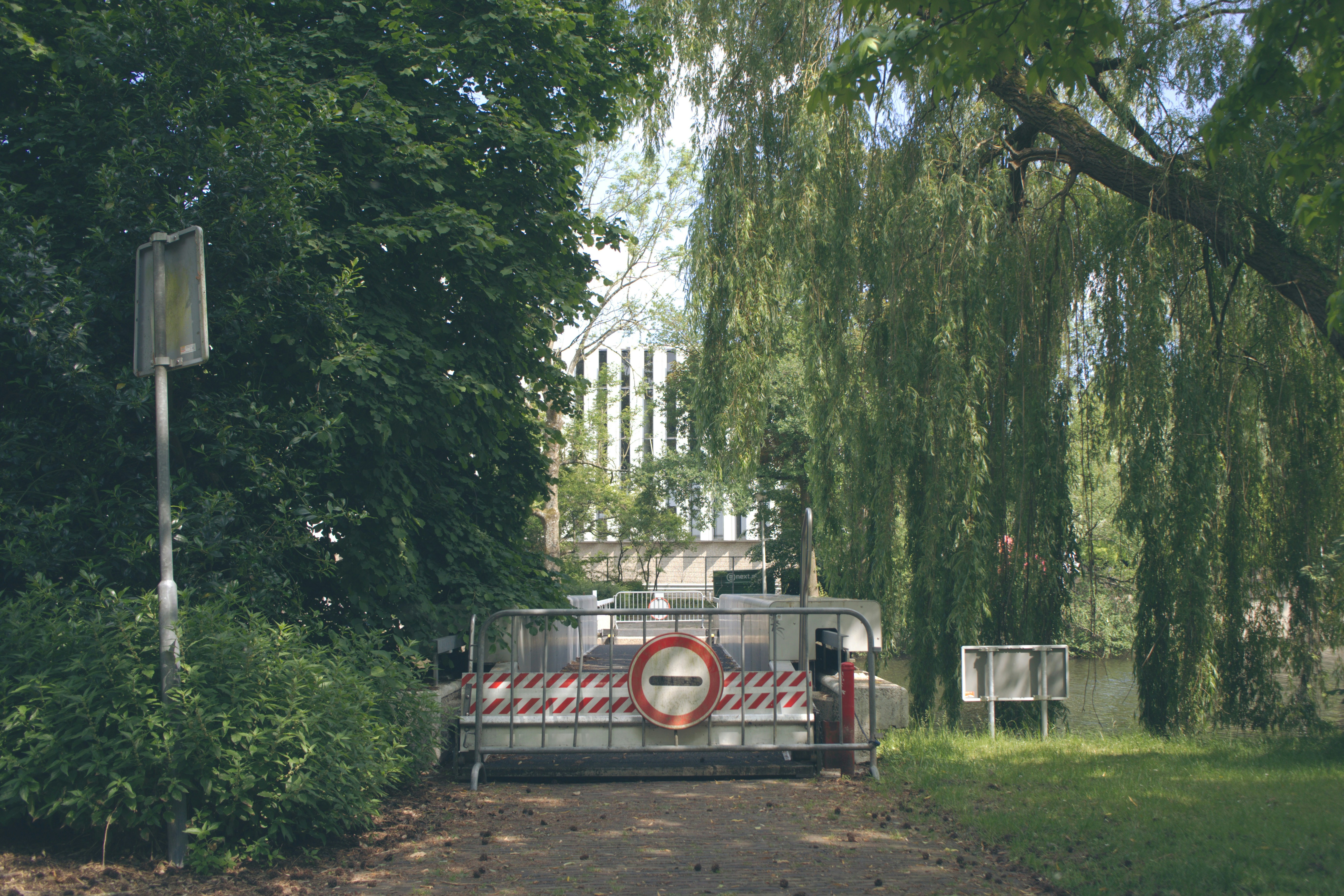 A path leads to a metal structure in nature.