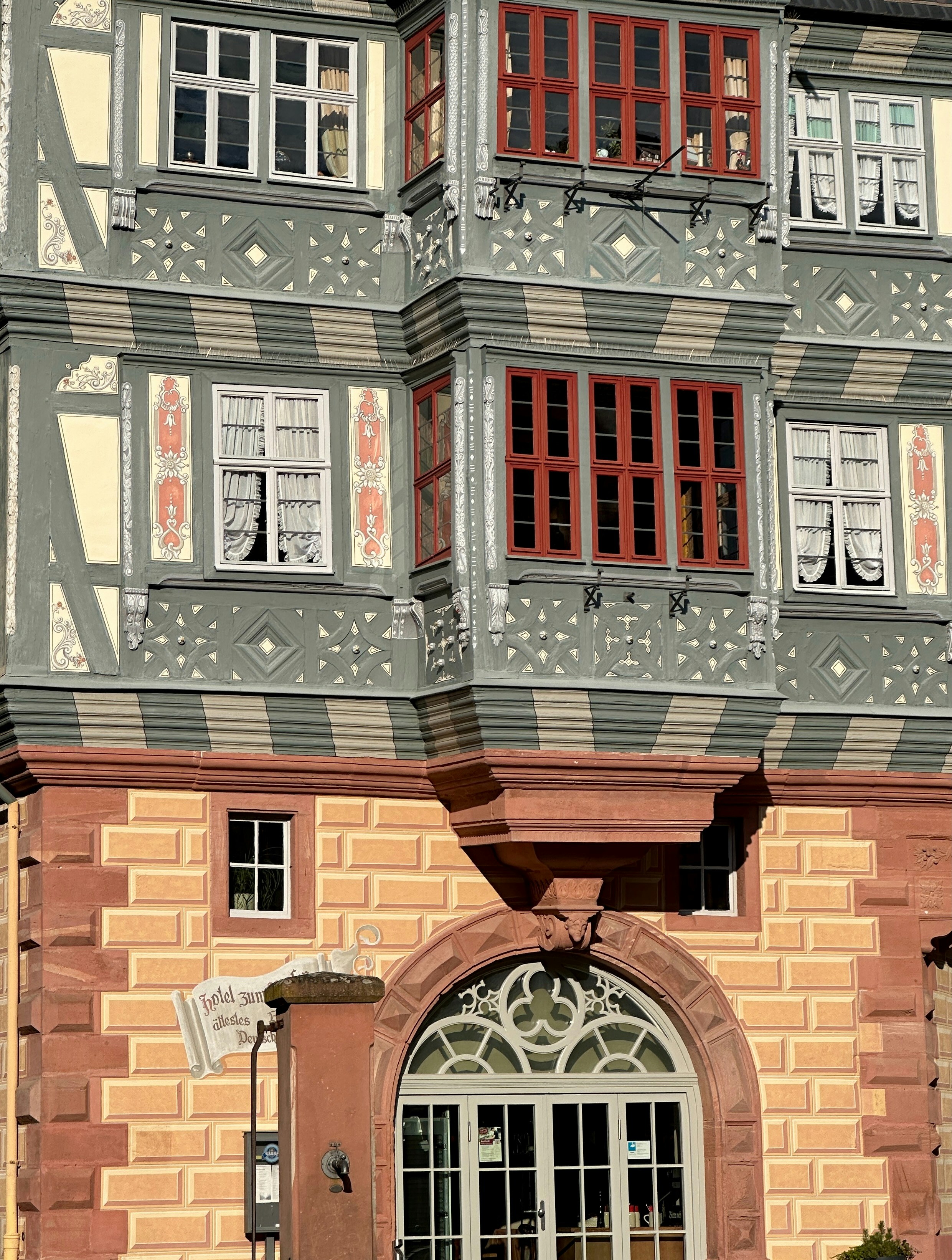 An ornate building with windows and detailed architecture.