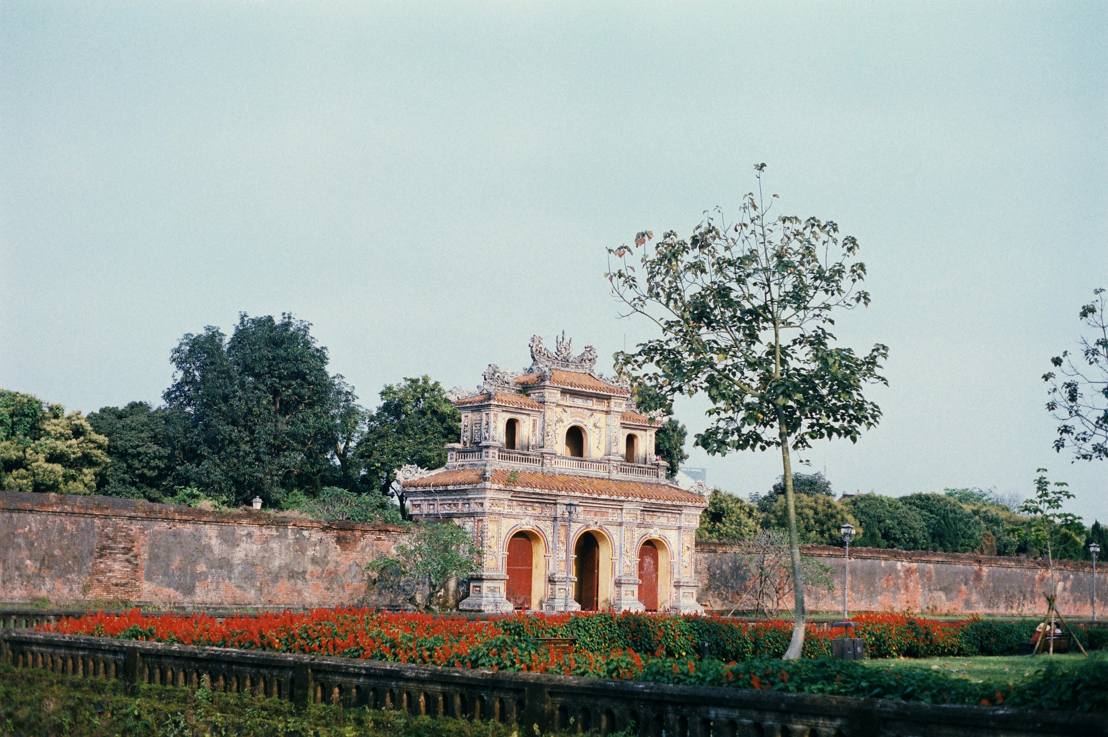 Ancient architecture with ornate gate and wall.