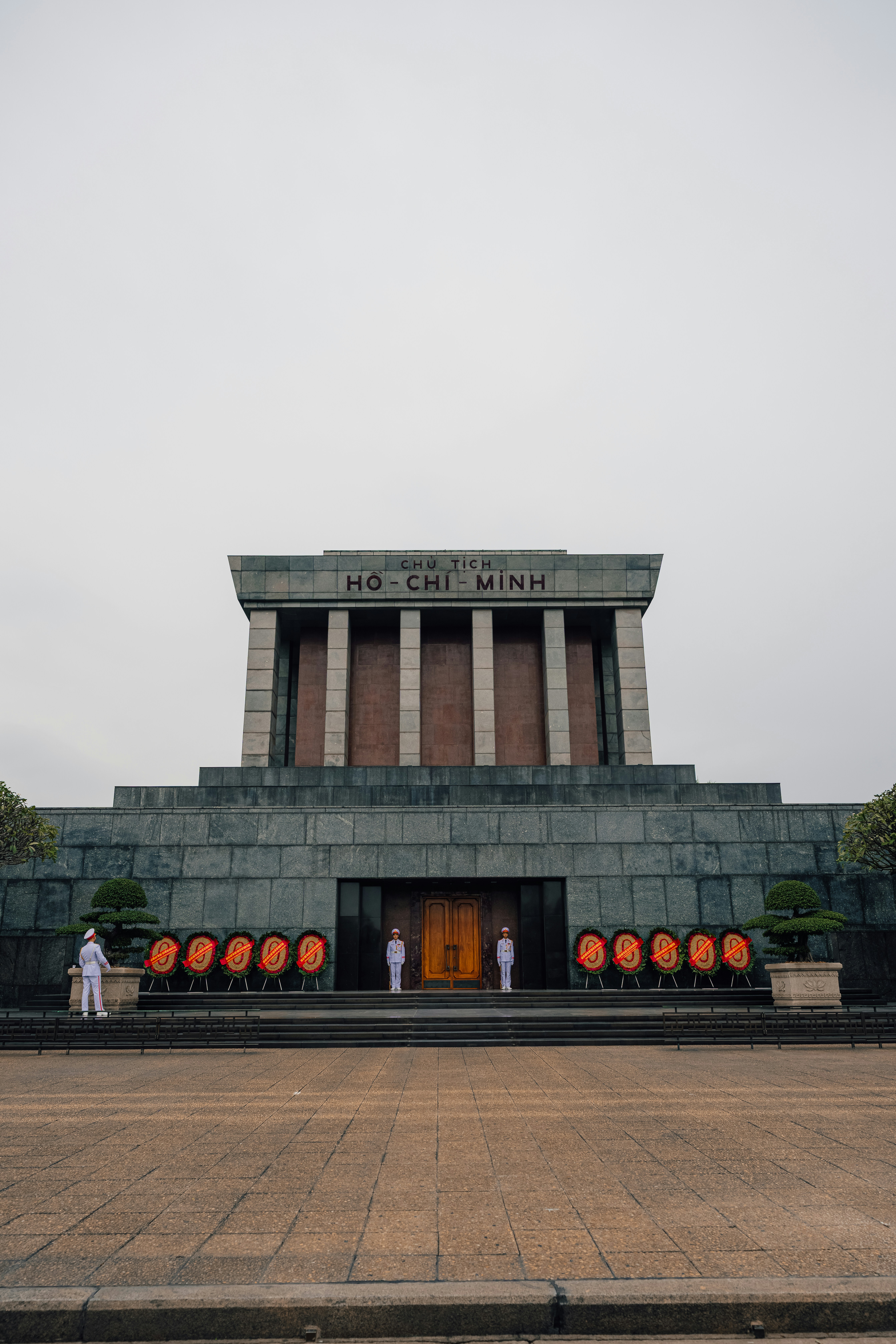 Monumental Symmetry at Ho Chi Minh Memorial: Wreaths Framing the Grand Entrance