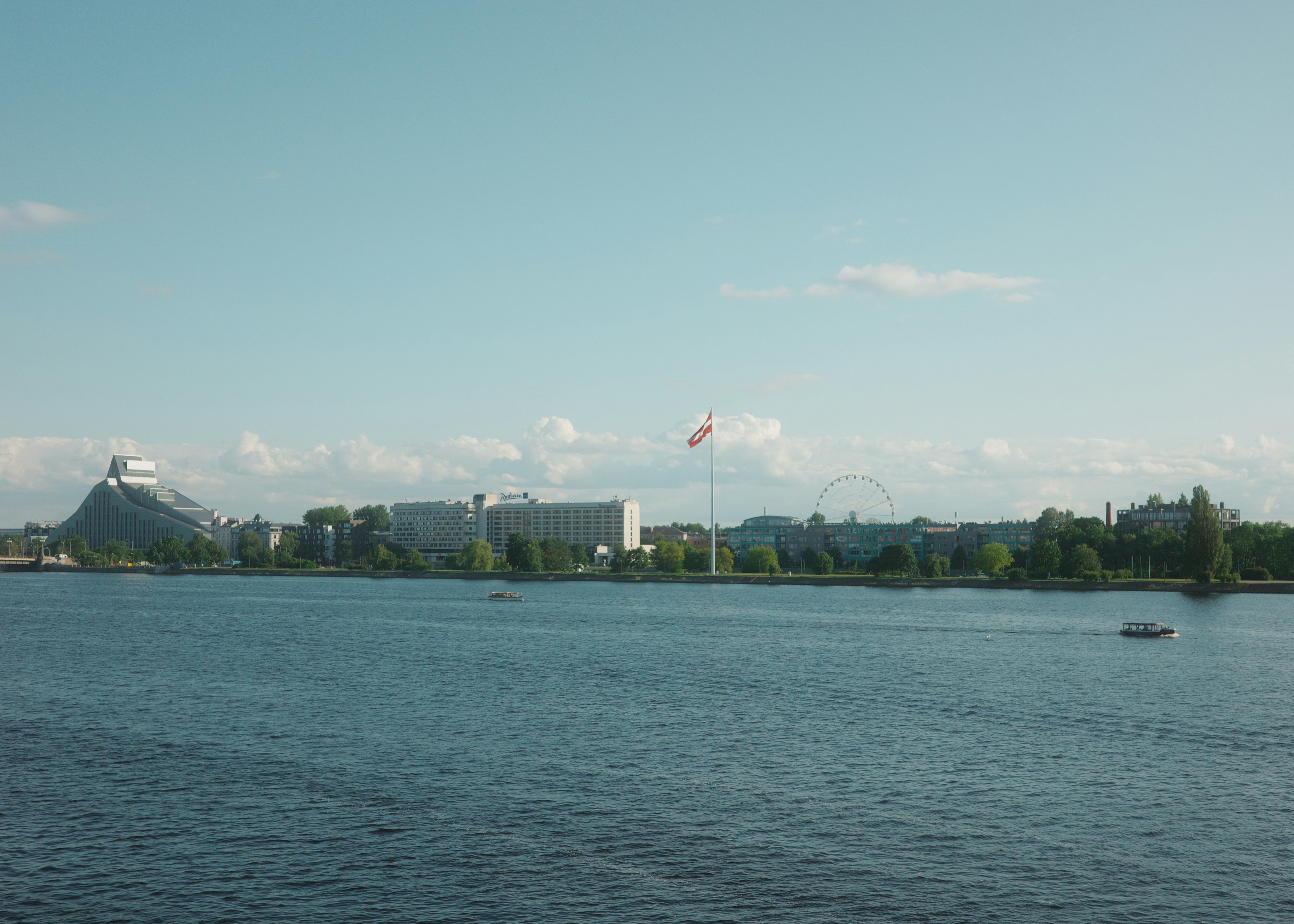 A cityscape view across the water on a sunny day.
