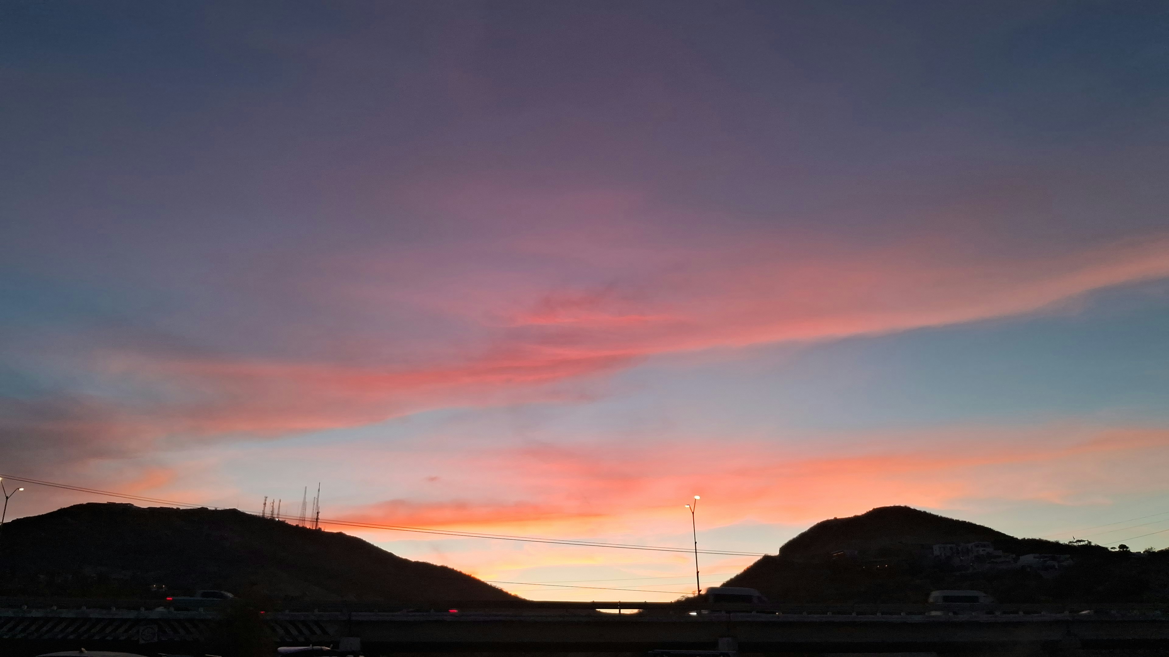 Twilight's Brush: A Palette of Colors Over the Hills