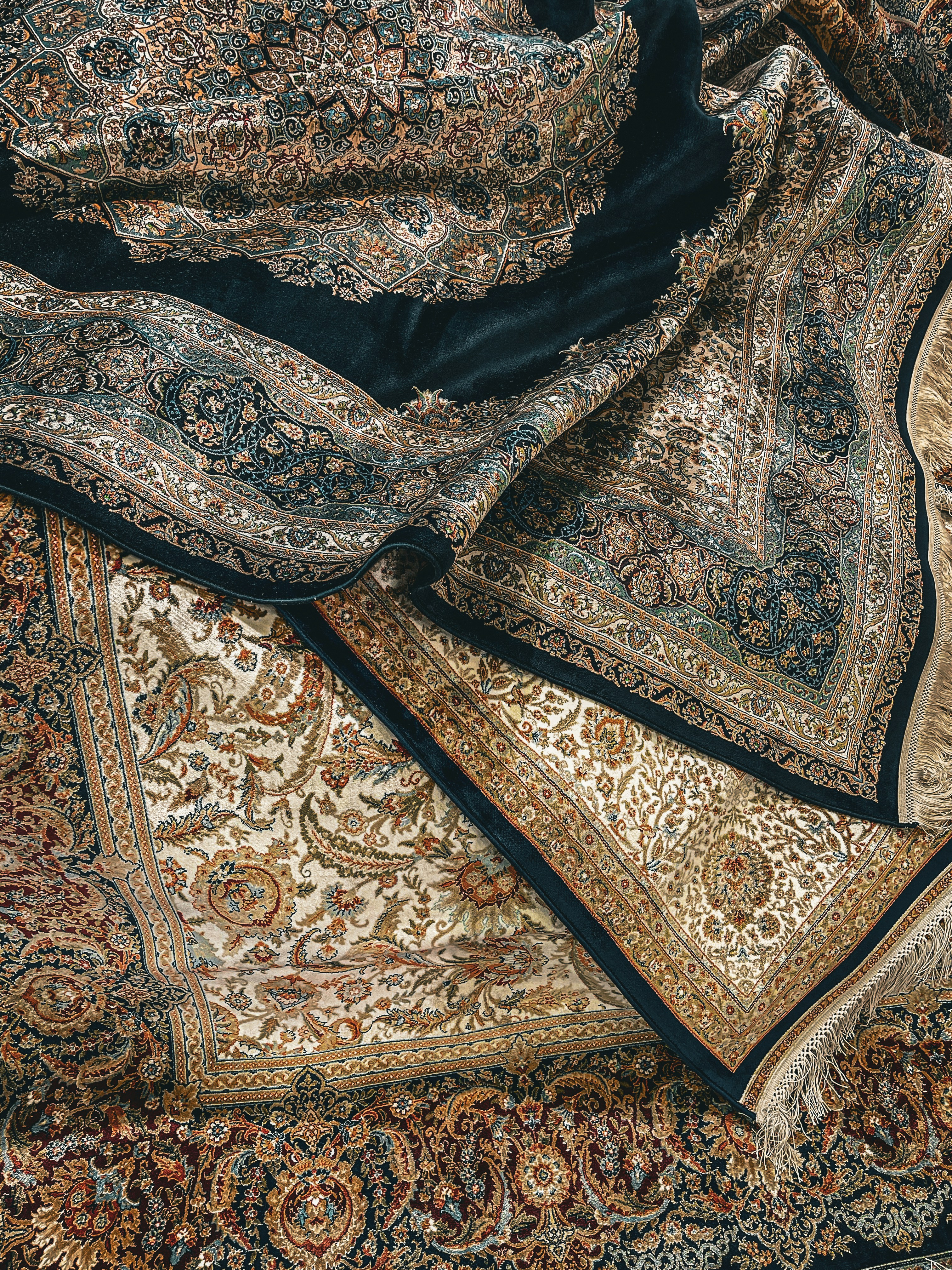 Beautiful oriental rugs with intricate patterns are on display. photo ...