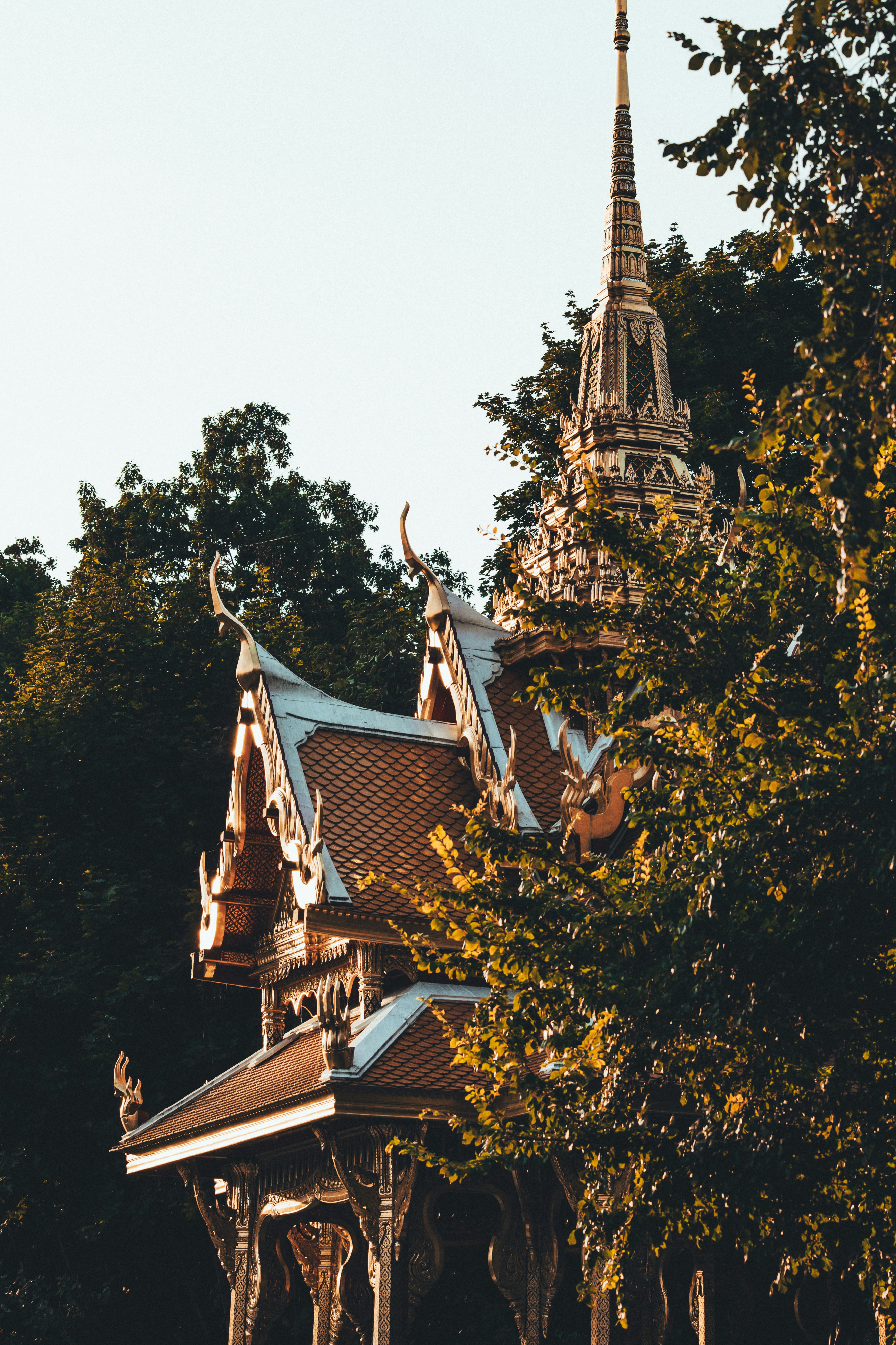 A beautiful temple is surrounded by lush trees.