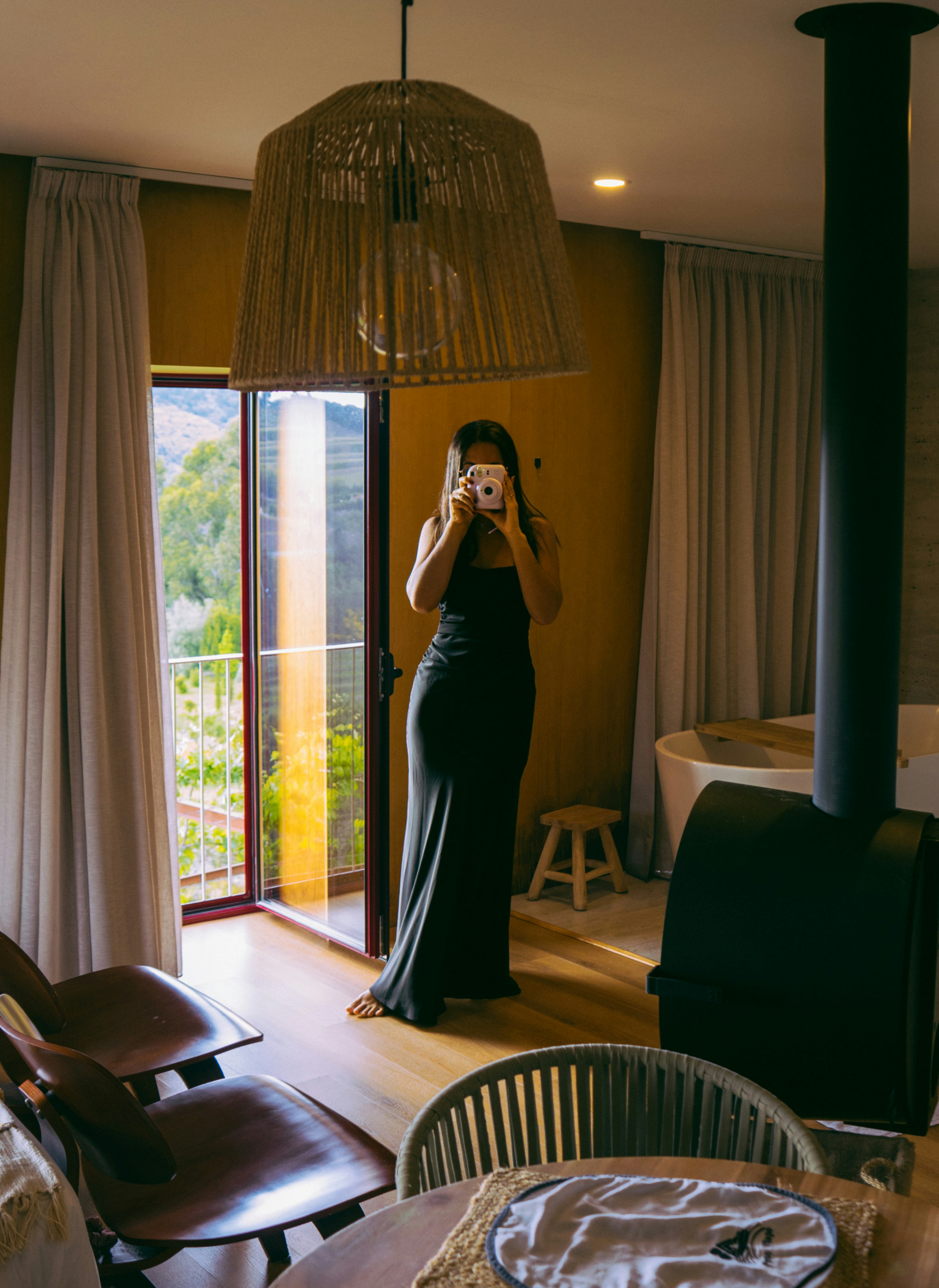 Echoes in a Dim Loft: Black Dress at the Balcony Window