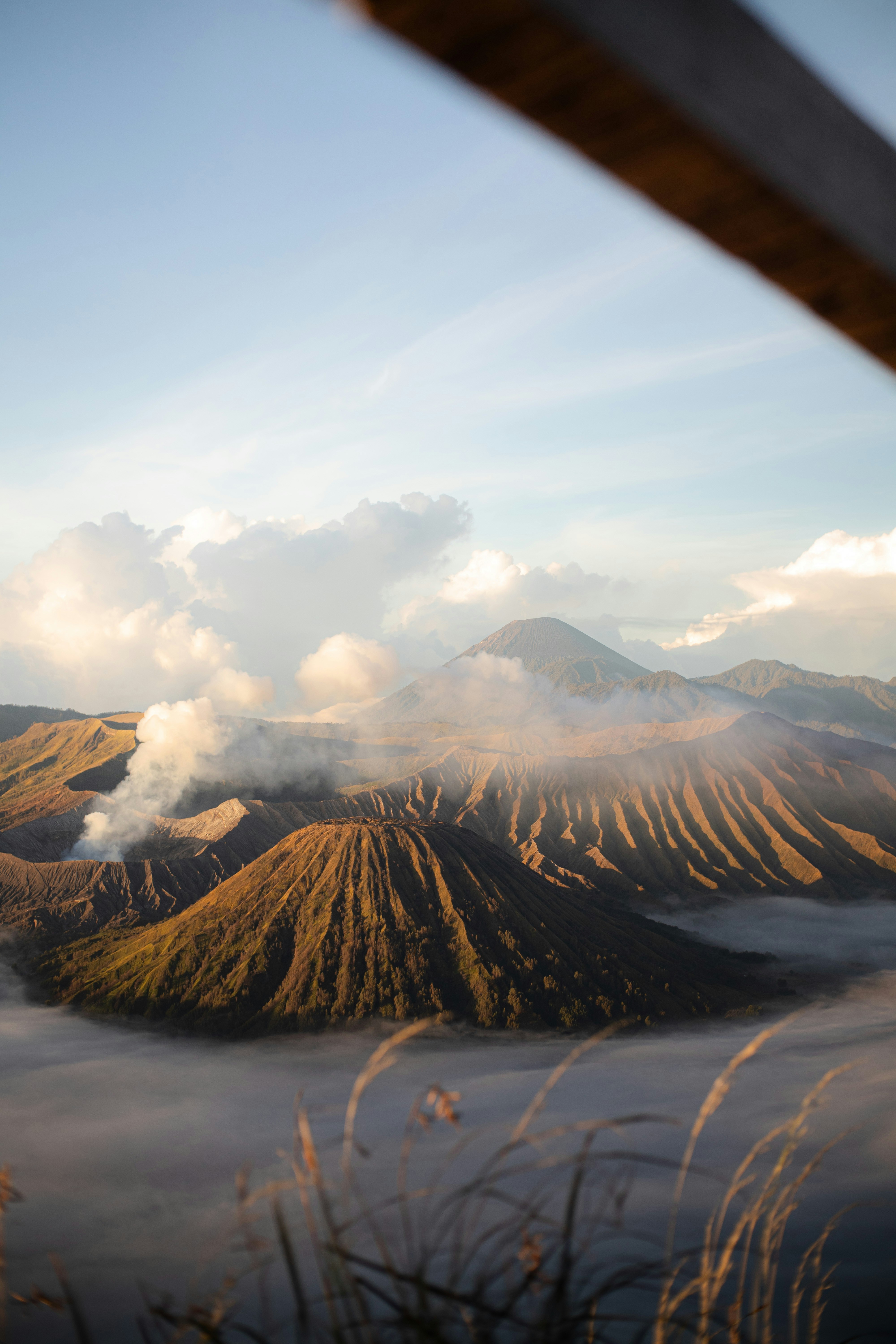 Volcanoes peak above the clouds during sunrise. photo – Free Travel Image on Unsplash
