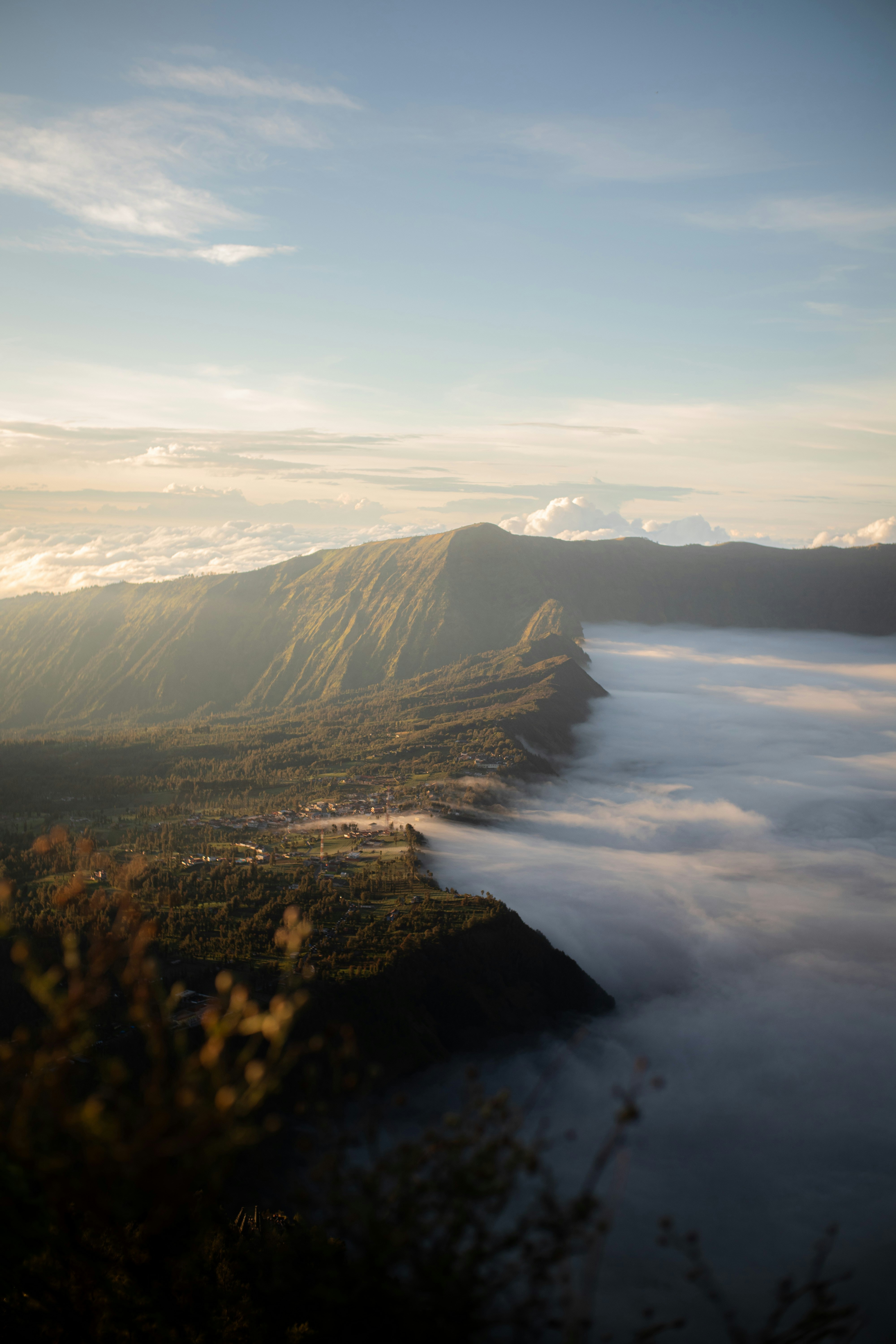 Mountains emerge from a sea of morning fog.