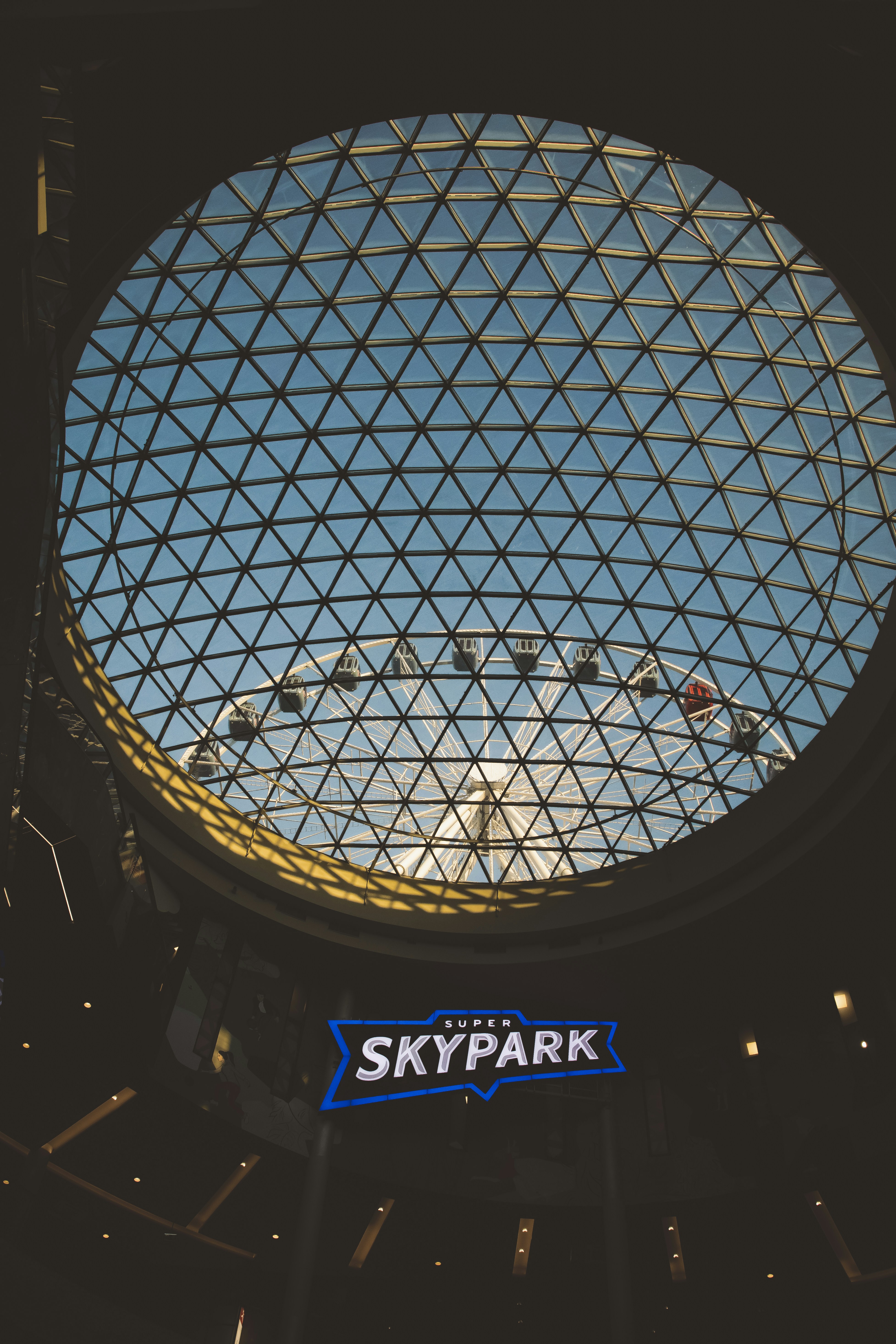 Aerial Geometry: The Ferris Wheel Beneath Glass