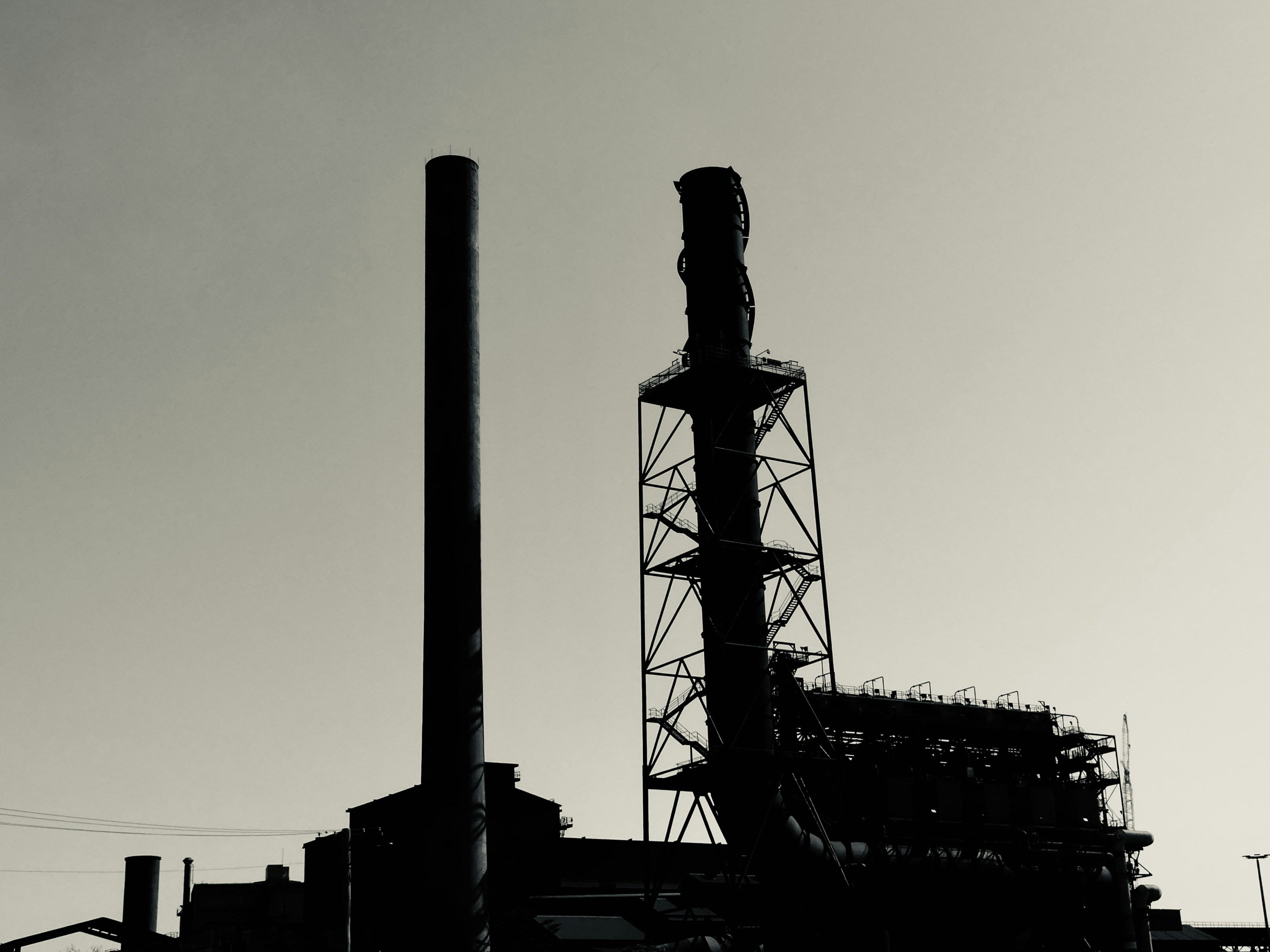 Industrial Silhouettes Against a Fading Sky