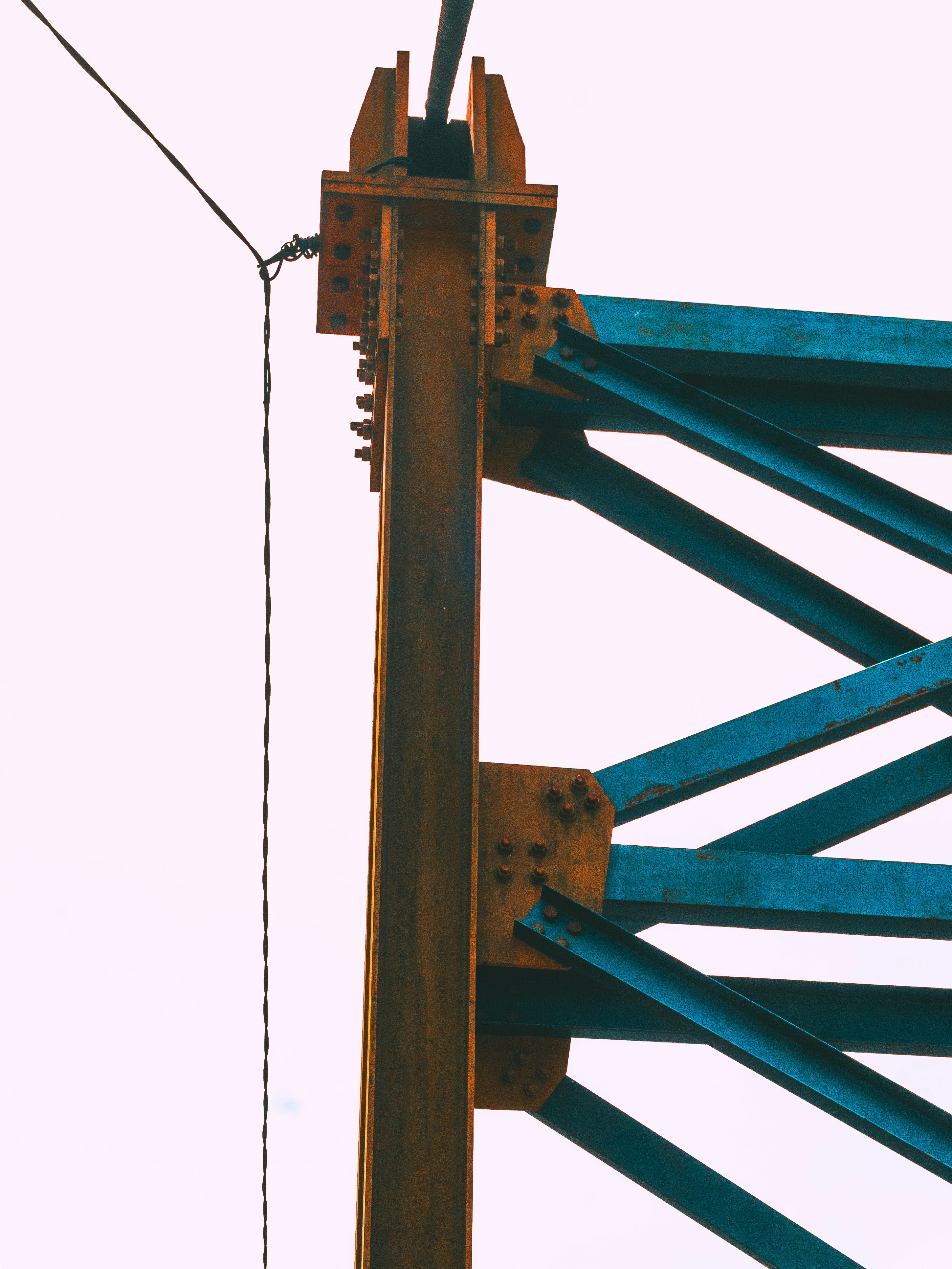 Steel support construction with wires overhead.