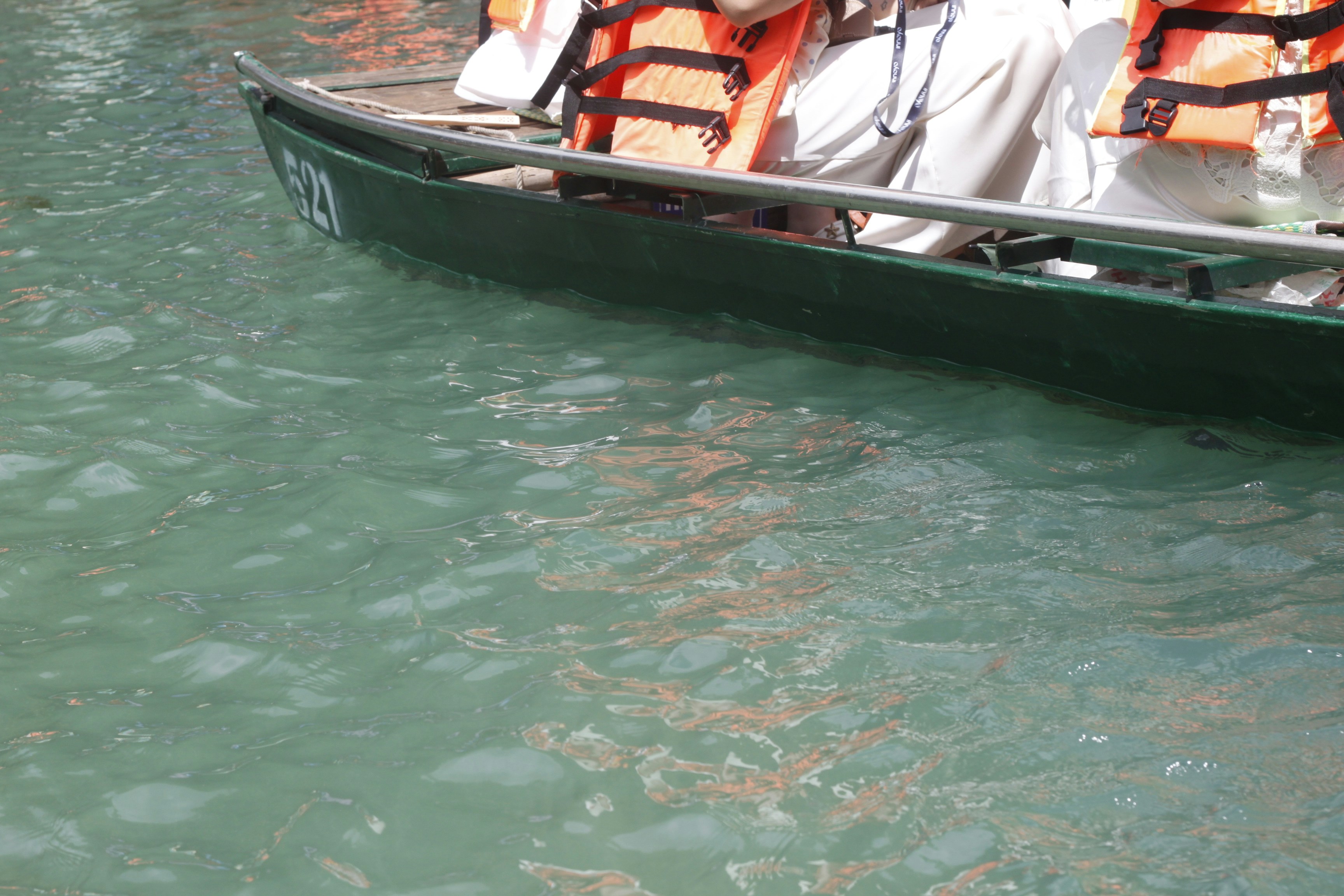 People are in a boat on the water.