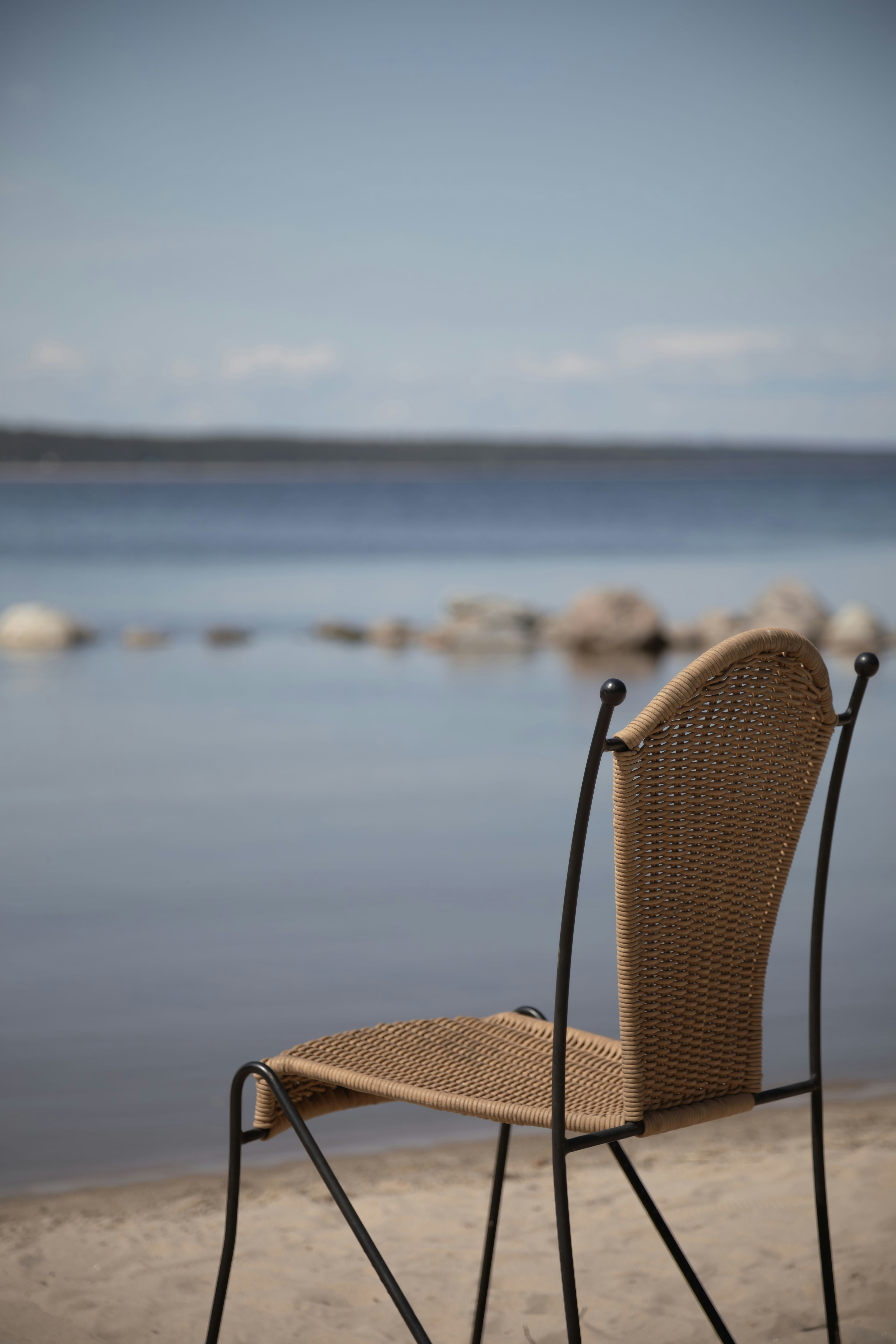 Solitary Teak: A Beach Chair Guarding the Quiet Horizon