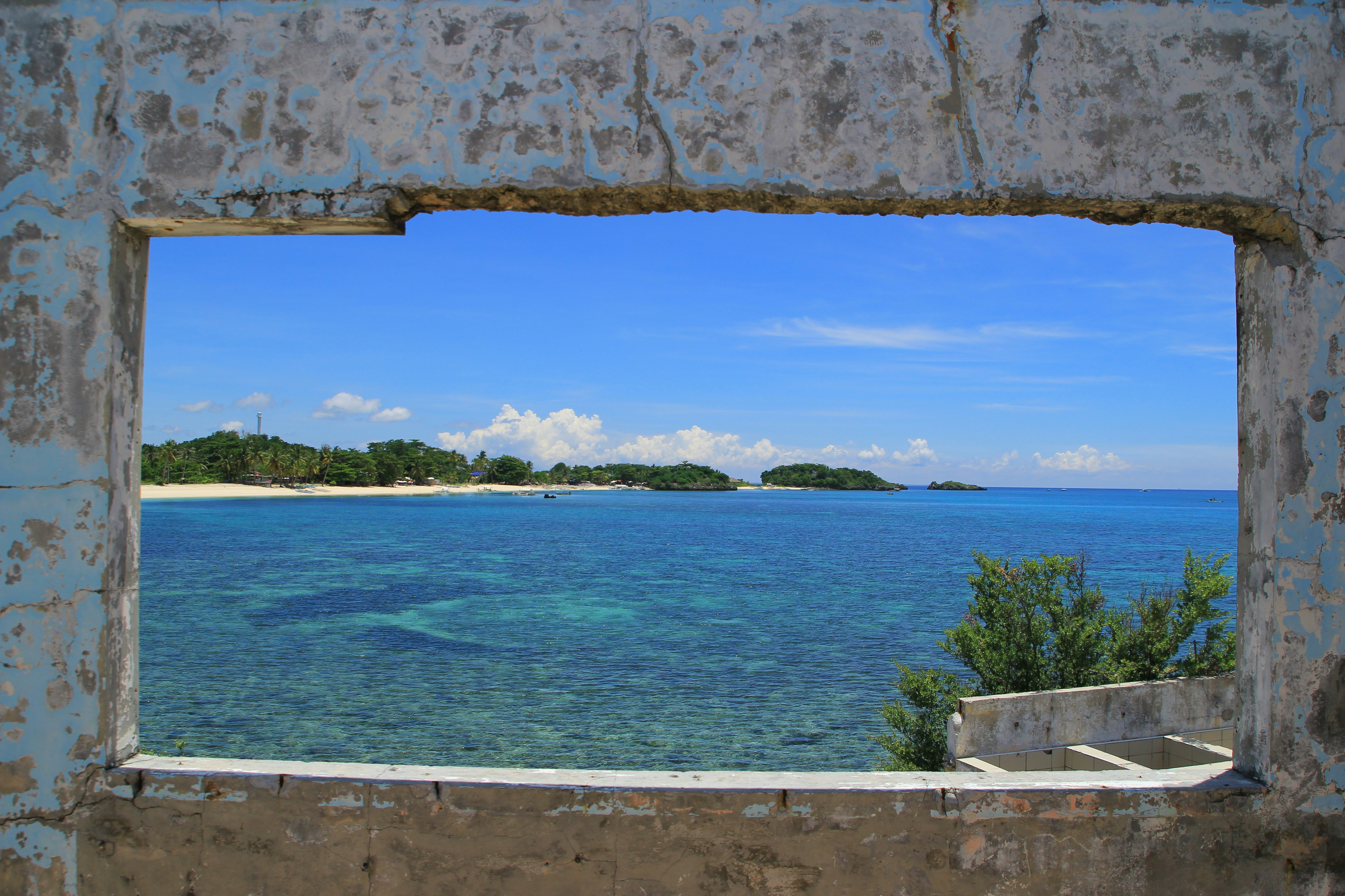 Framed Ocean Vista from a Weathered Window