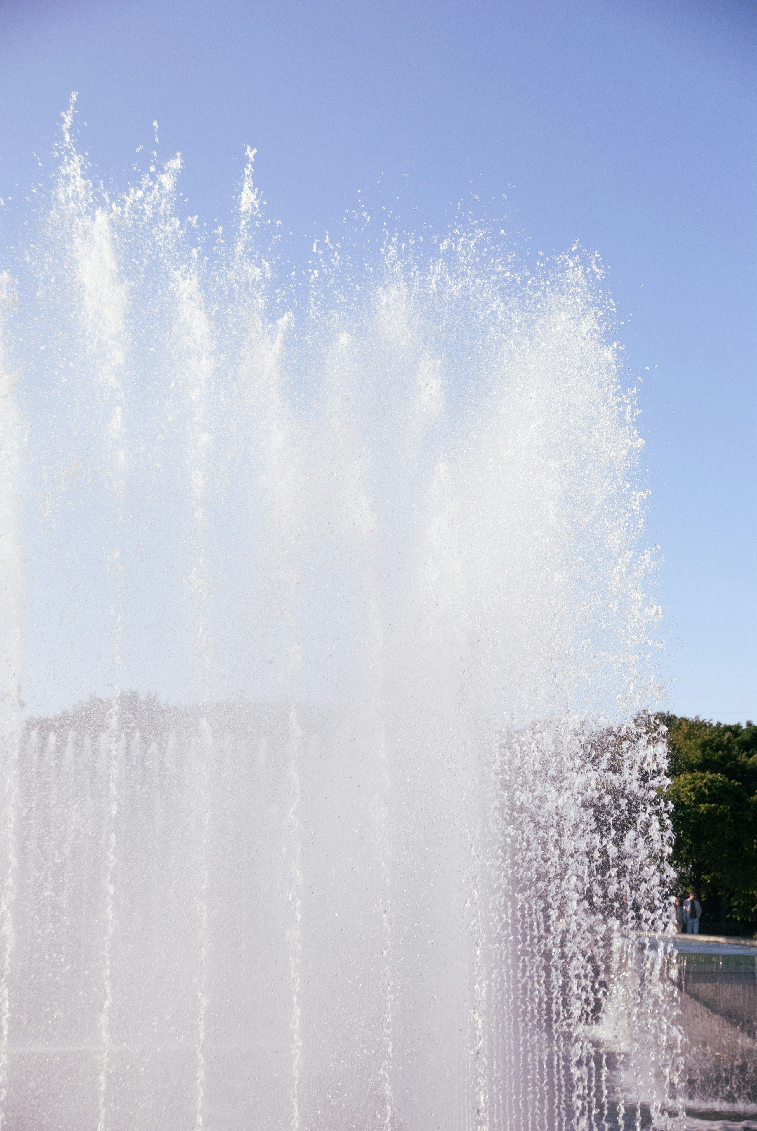SONY DSC | Water shoots high into the air from a fountain.