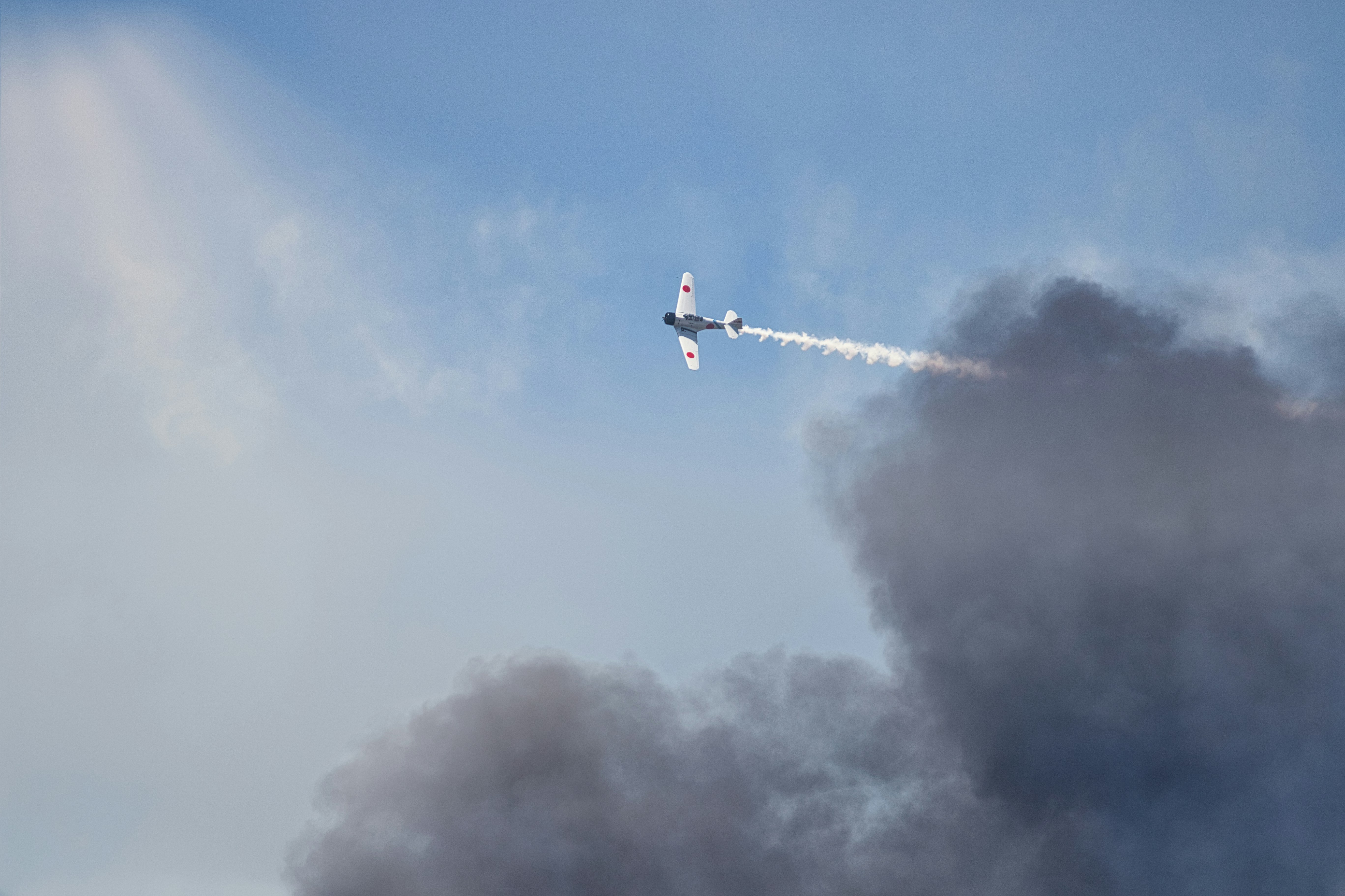 An airplane performs an acrobatic maneuver in the sky. photo – Free ...