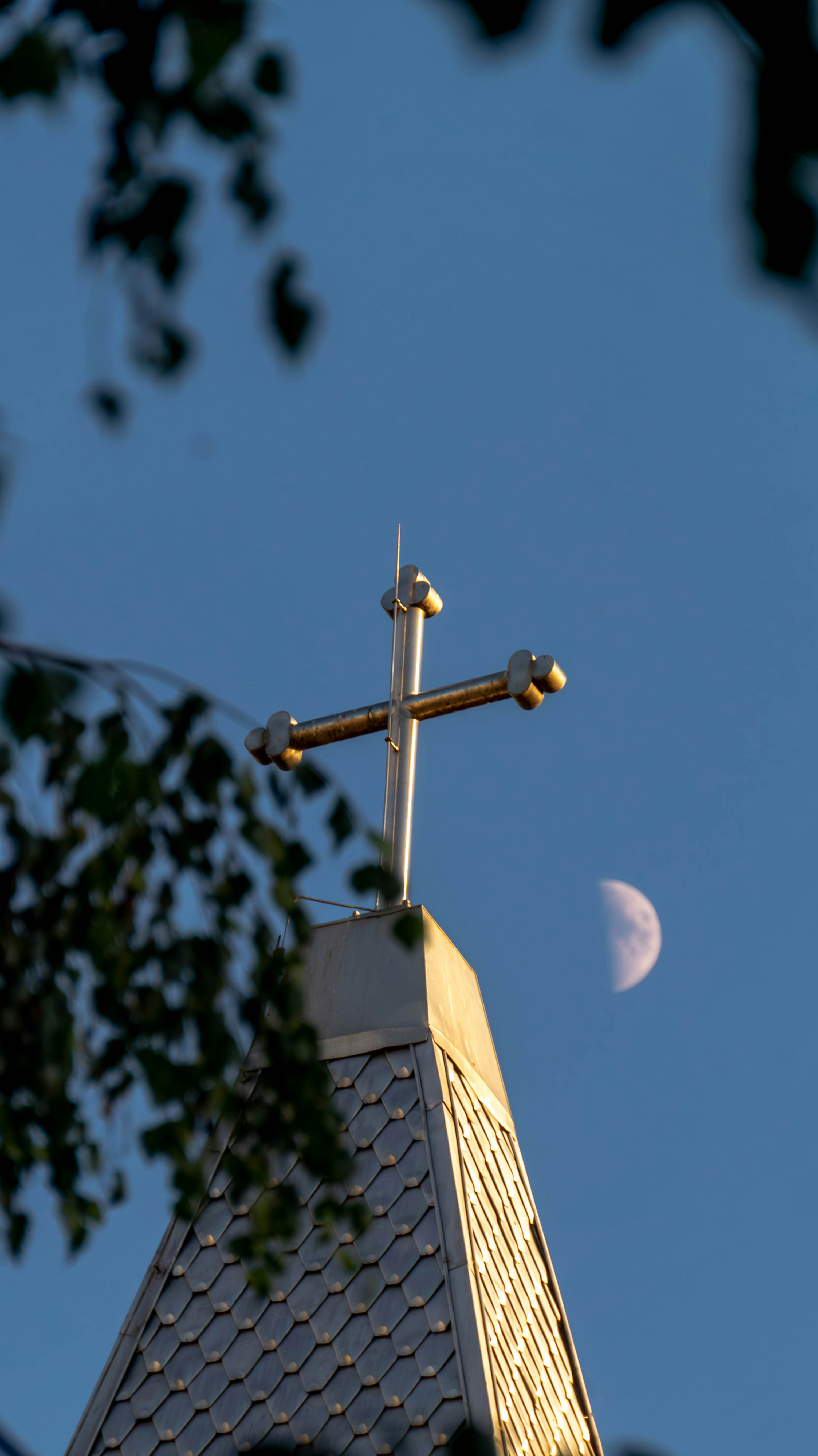 Celestial Harmony: A Cross Beneath the Moon