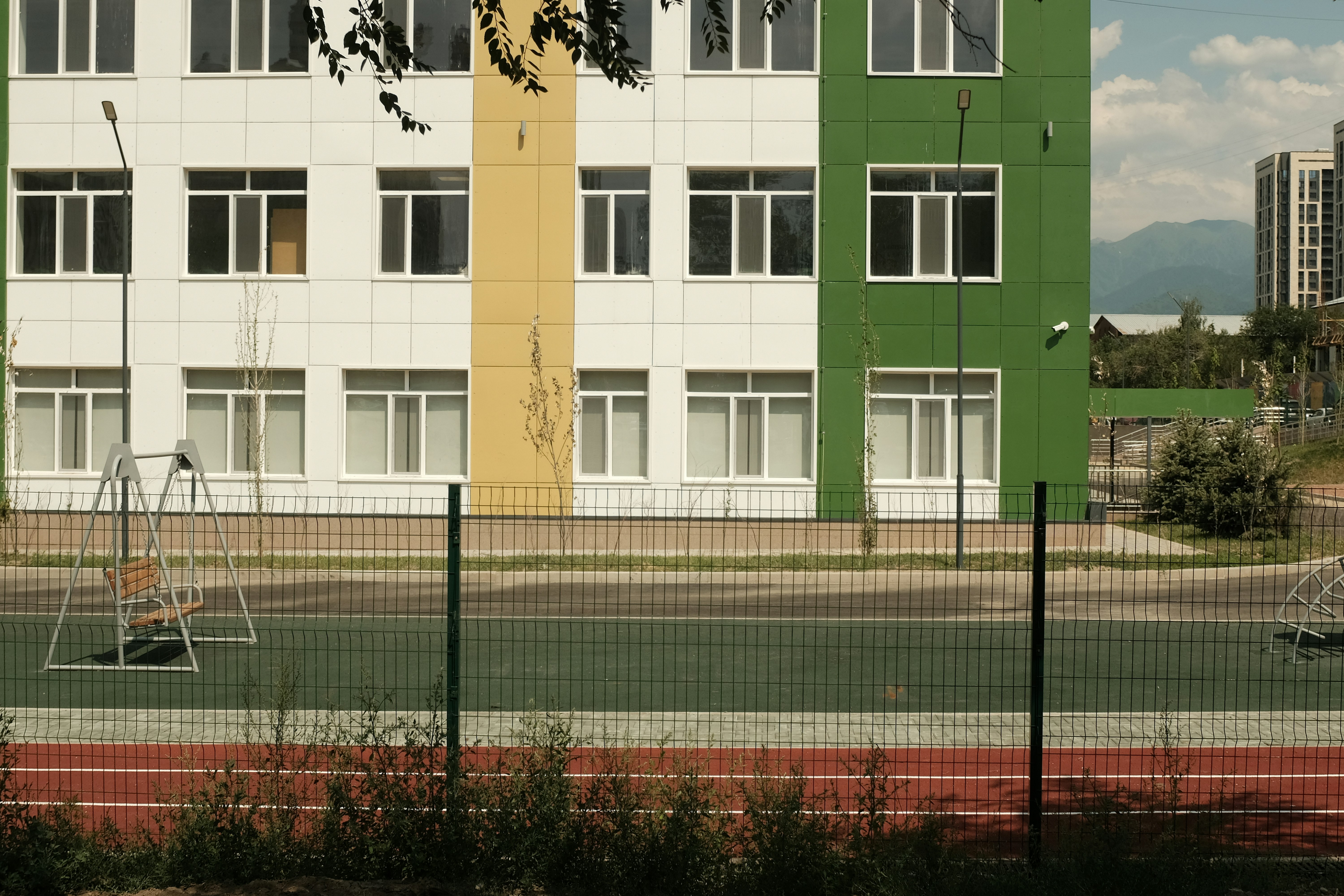 A colorful school building and playground.