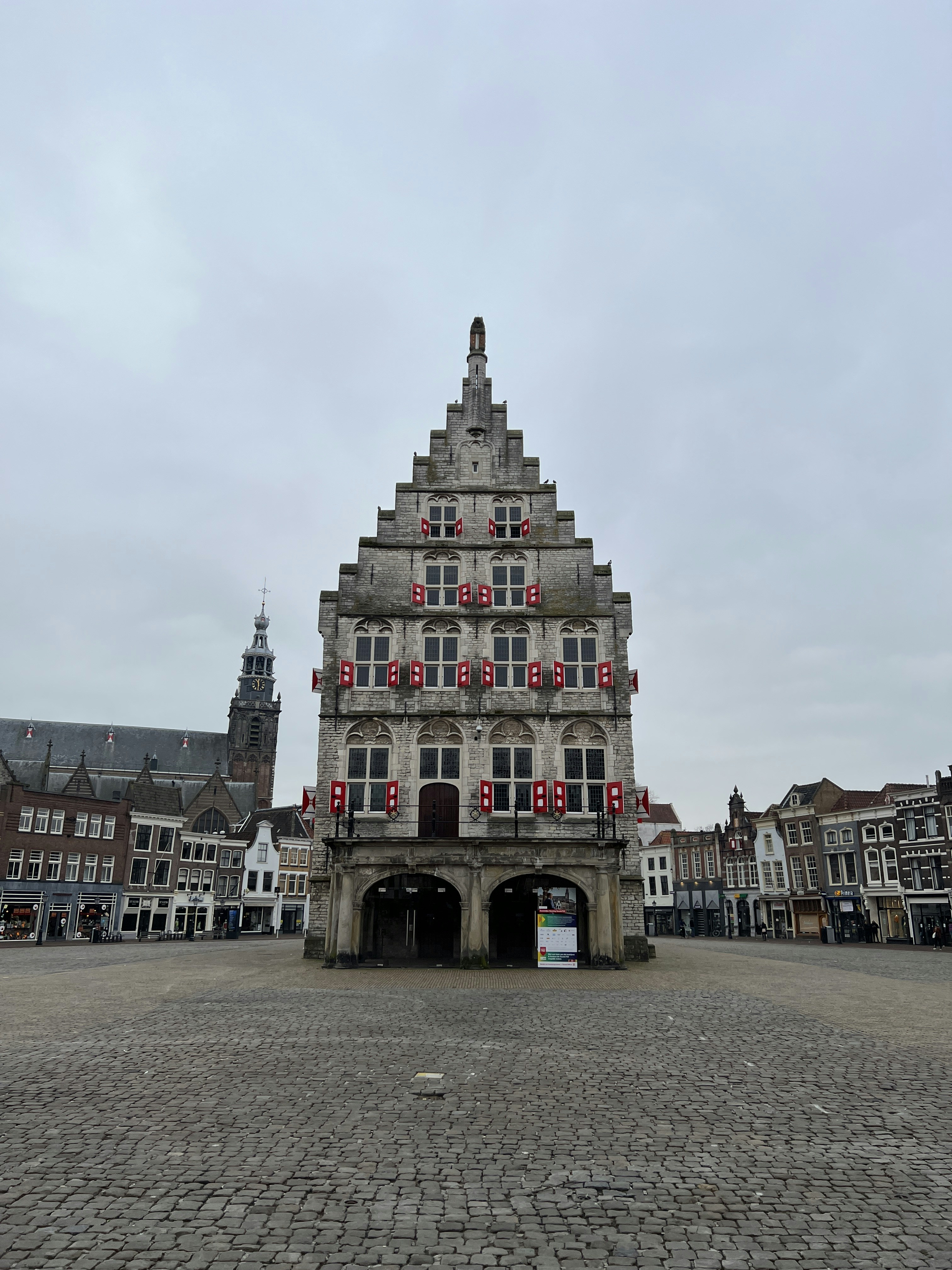 Step-Gabled Town Hall Anchored in a Cobblestone Square