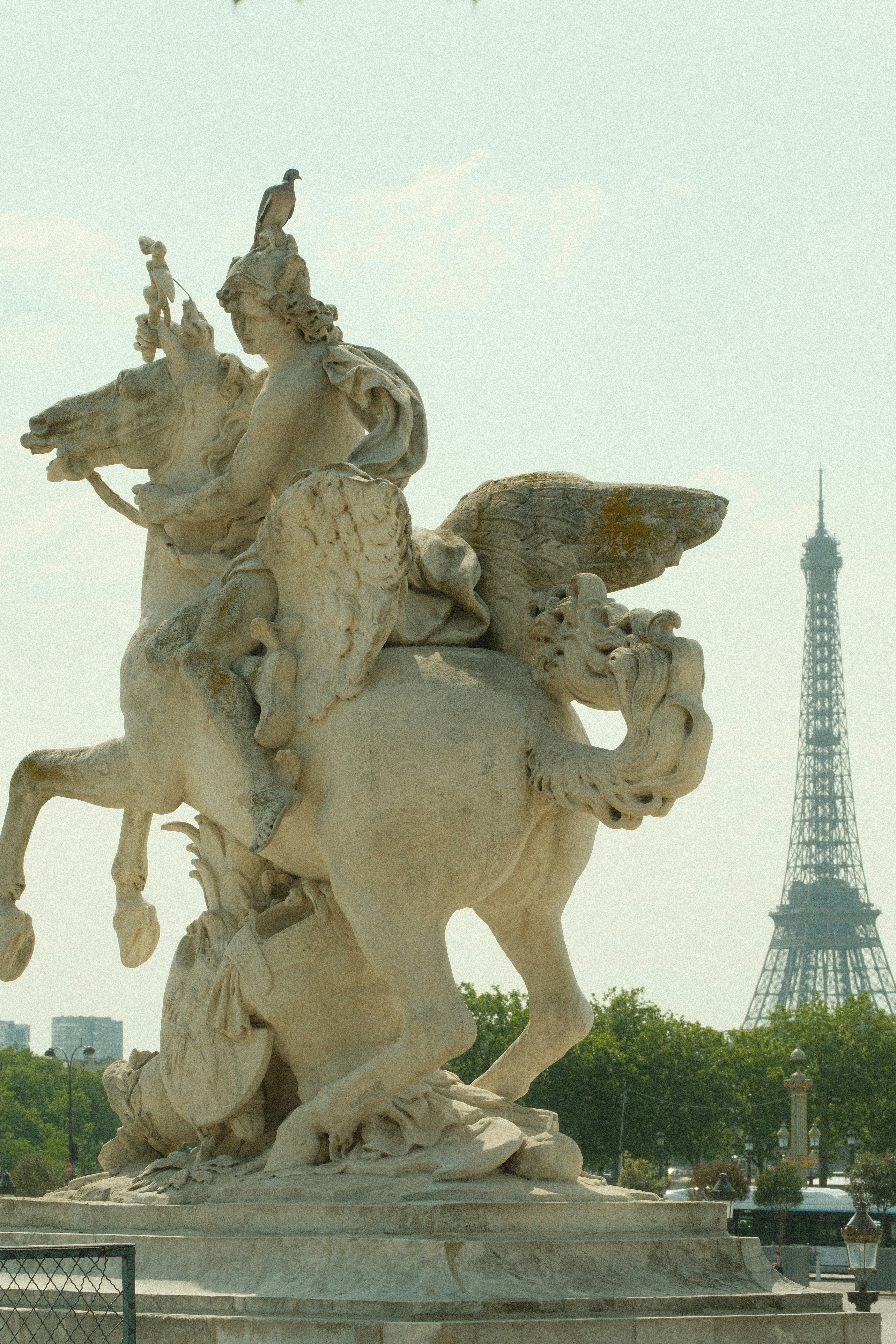 Winged Pegasus Under Paris Skies: Marble Valor with the Eiffel Tower on the Horizon