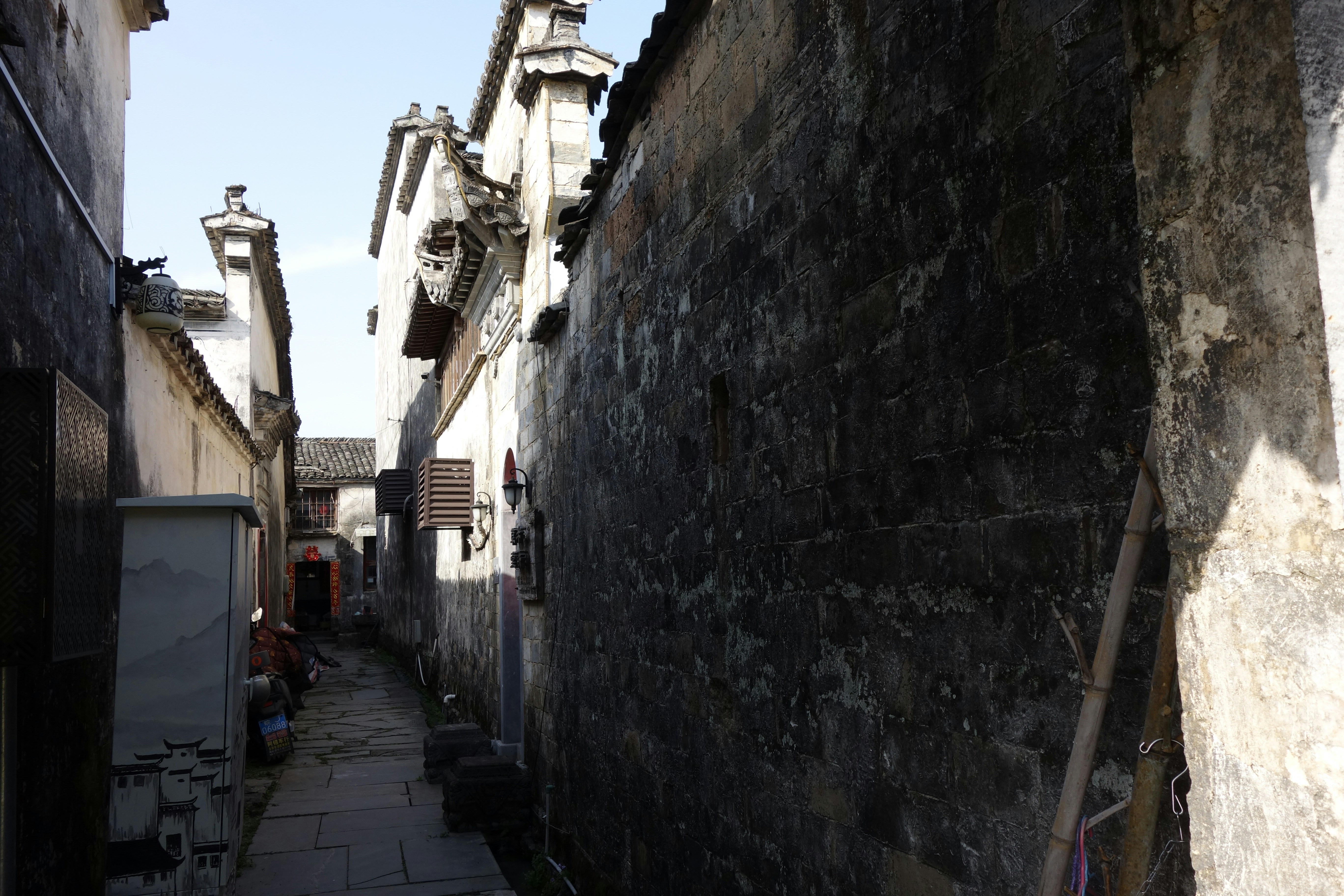 A narrow alleyway between old buildings.