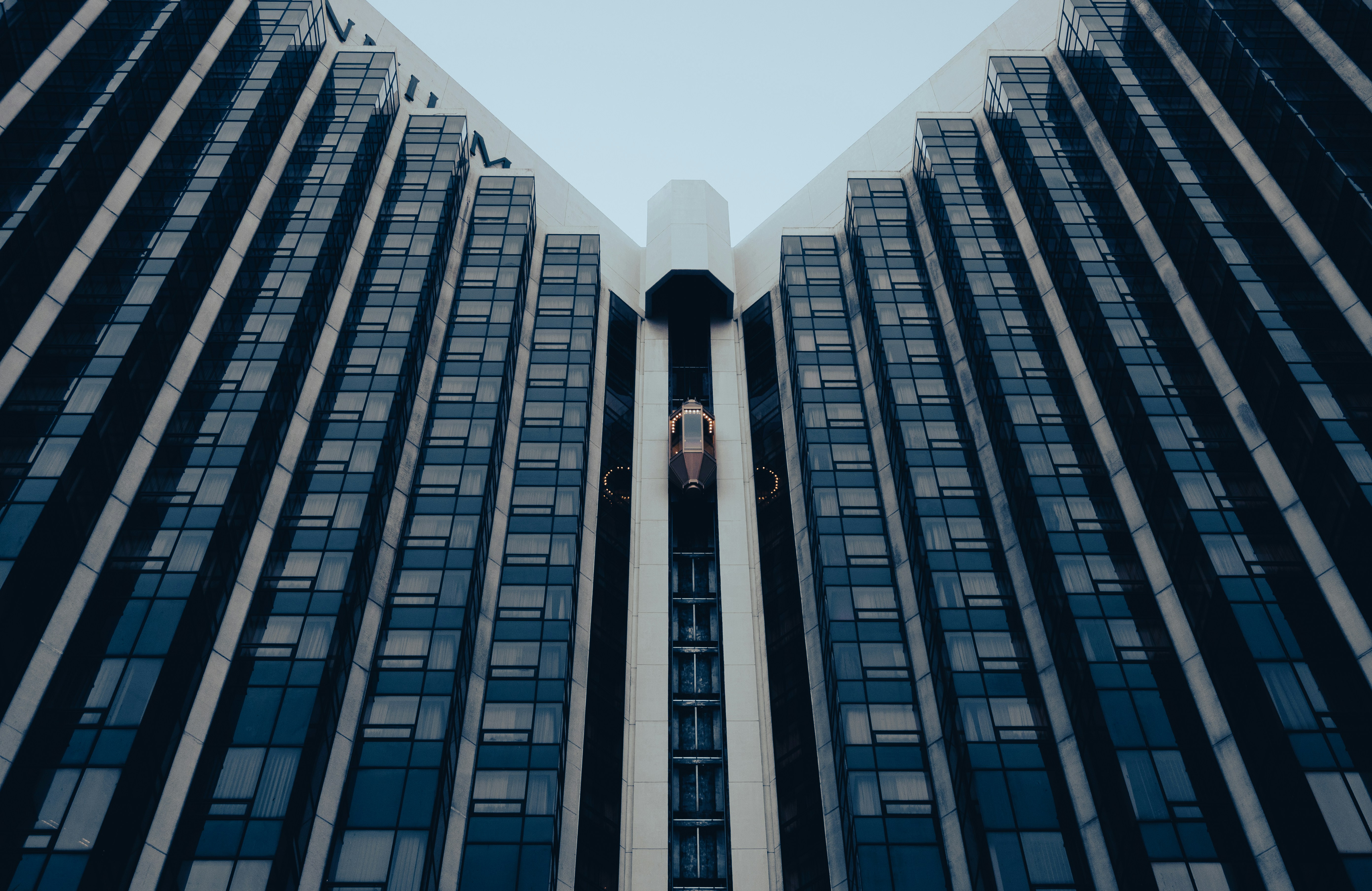 Low-angle view of a tall, modern building.