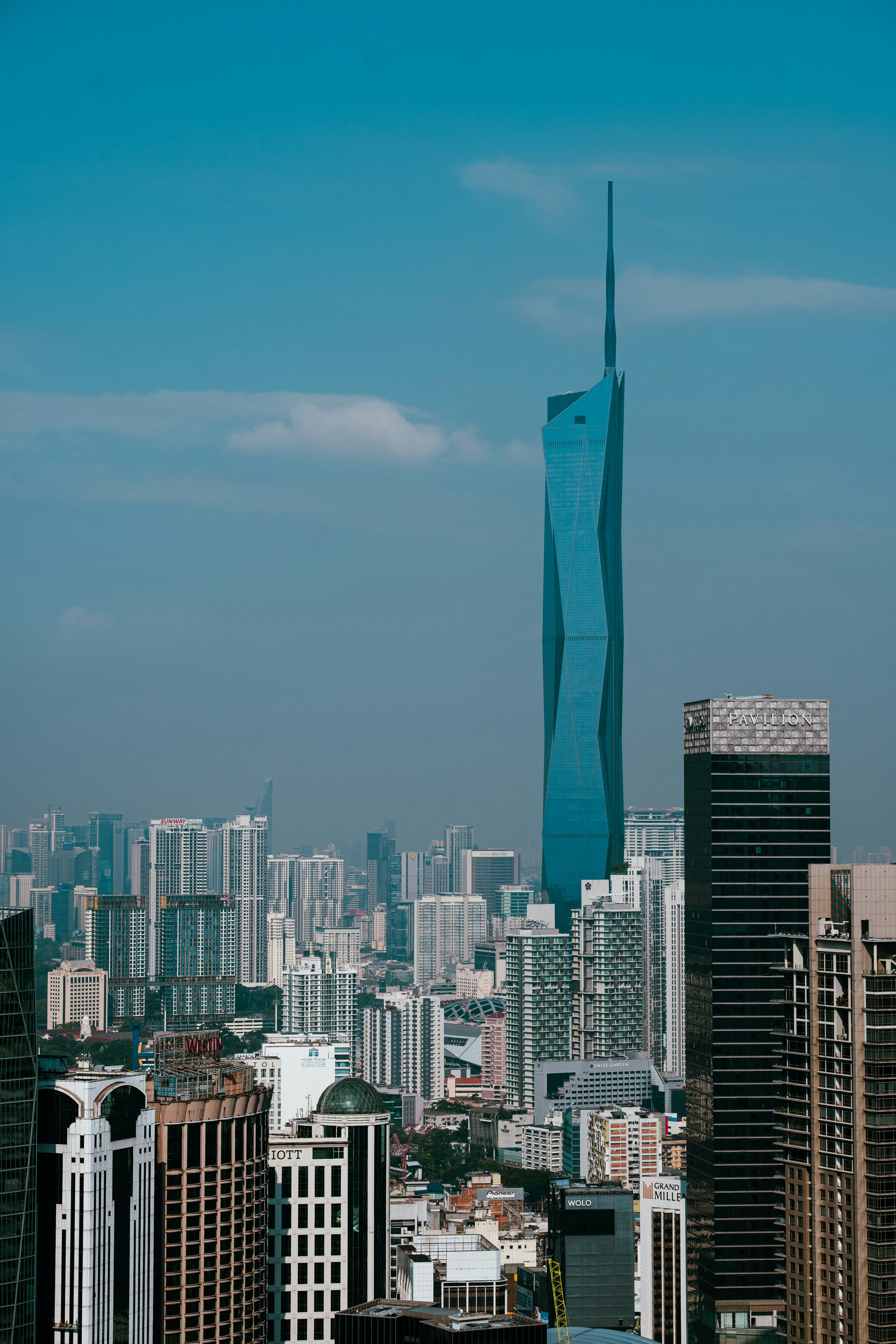 A modern skyscraper towers above the city skyline. photo – Free ...