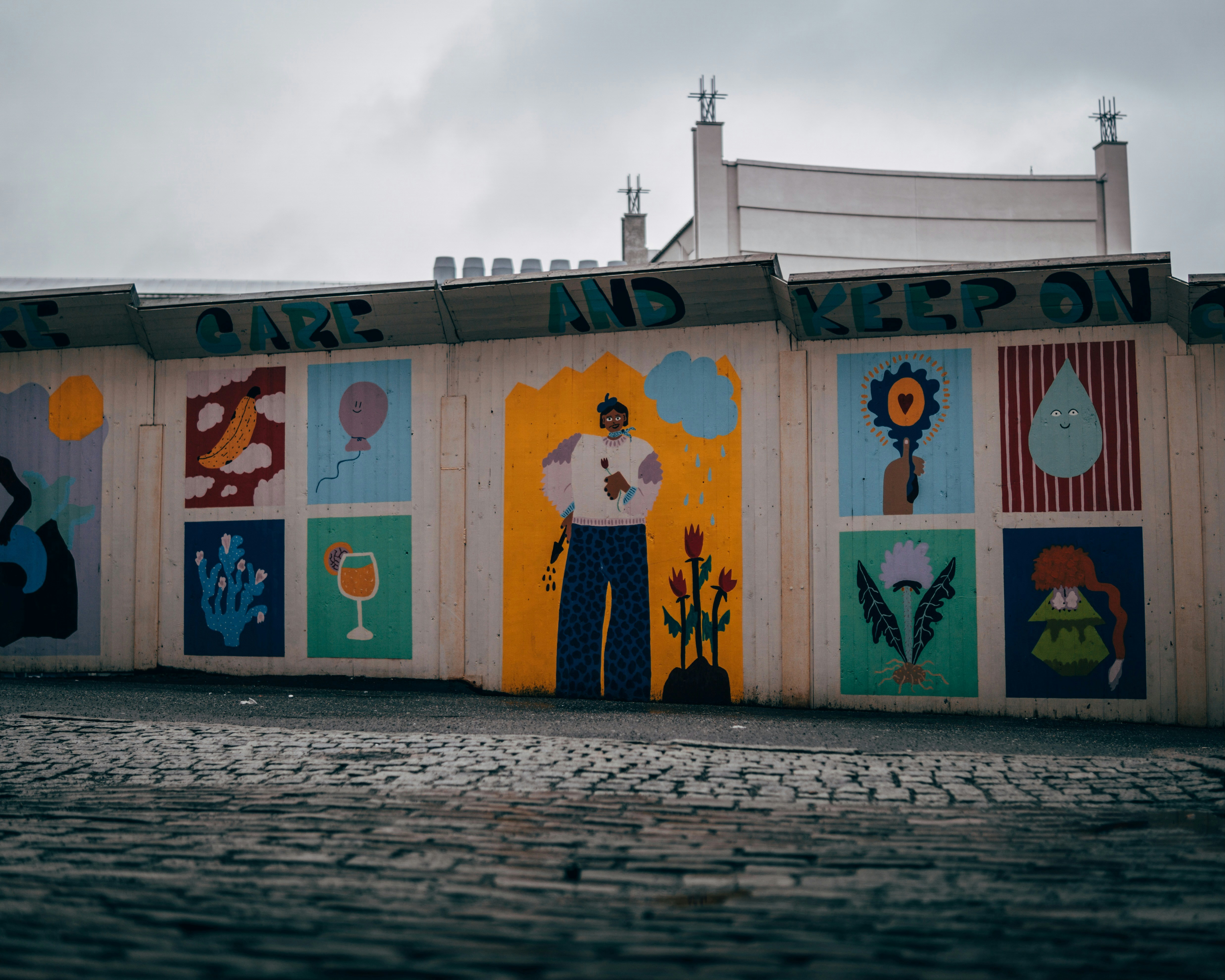 A street mural features art and a person.