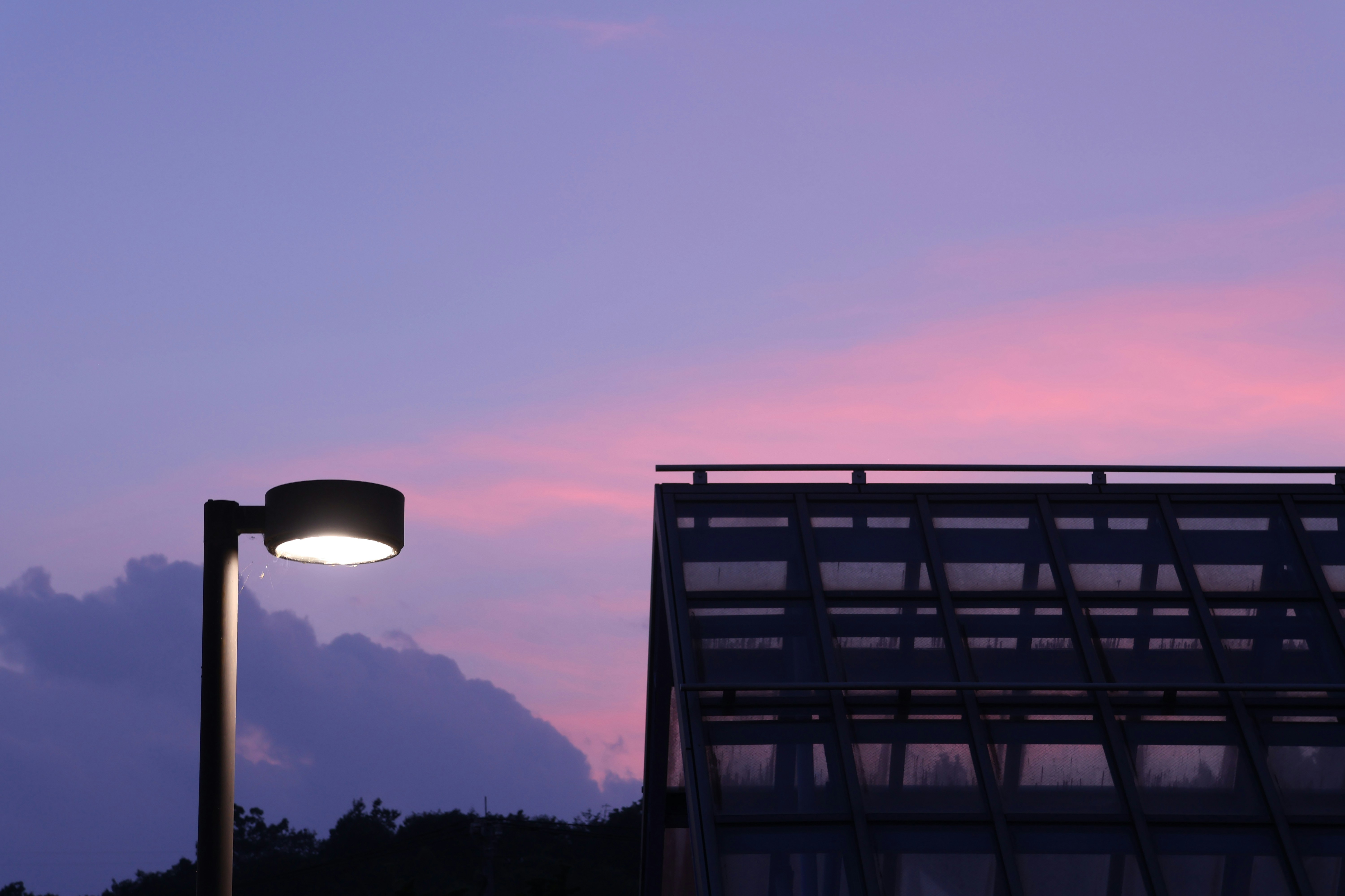 Twilight Gradient Against Glass and a Lone Streetlamp