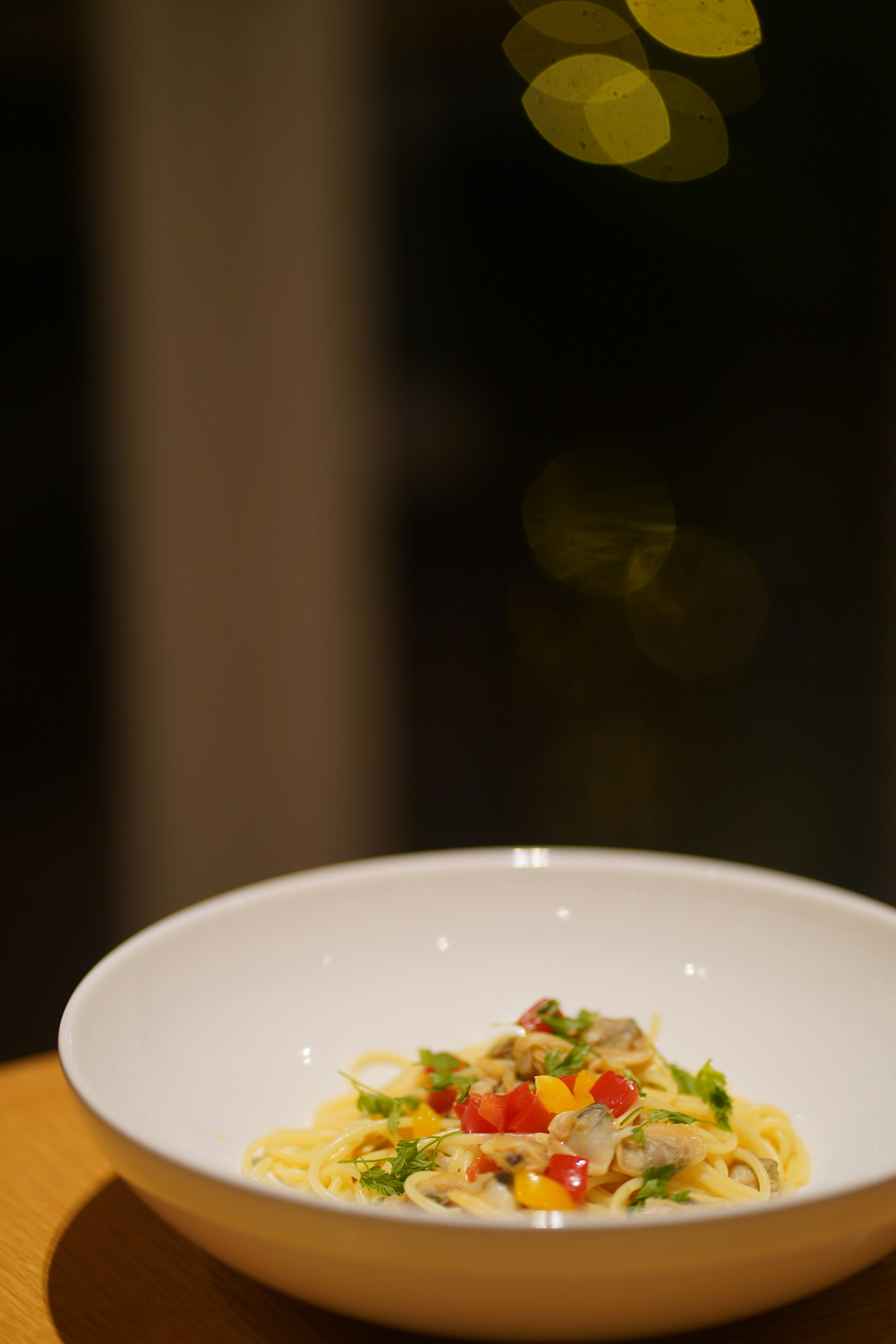 Seafood Pasta with Colorful Vegetables | Pasta dish in a white bowl, nicely presented.