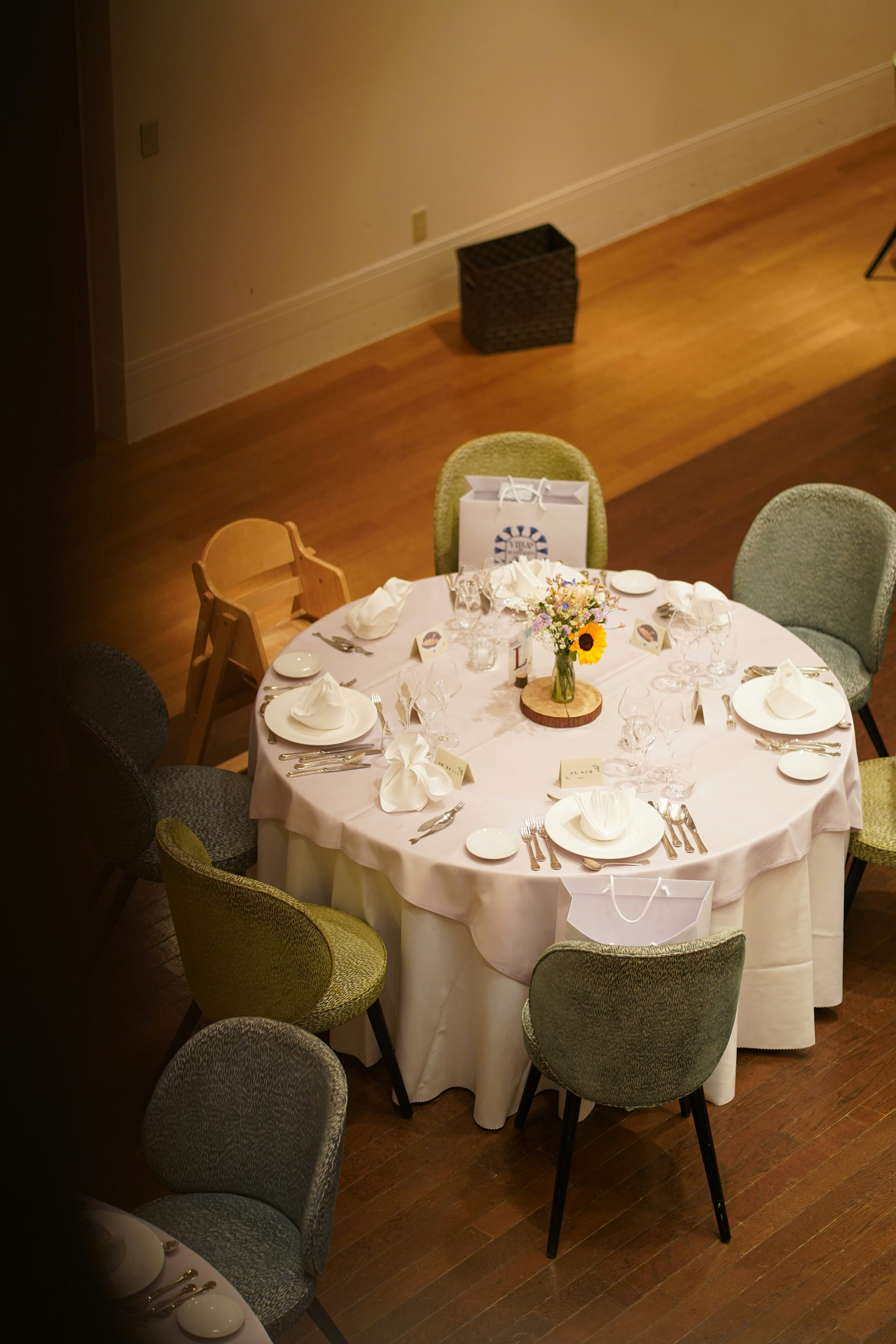 Indoor Wedding Reception | A round table is set for dinner.