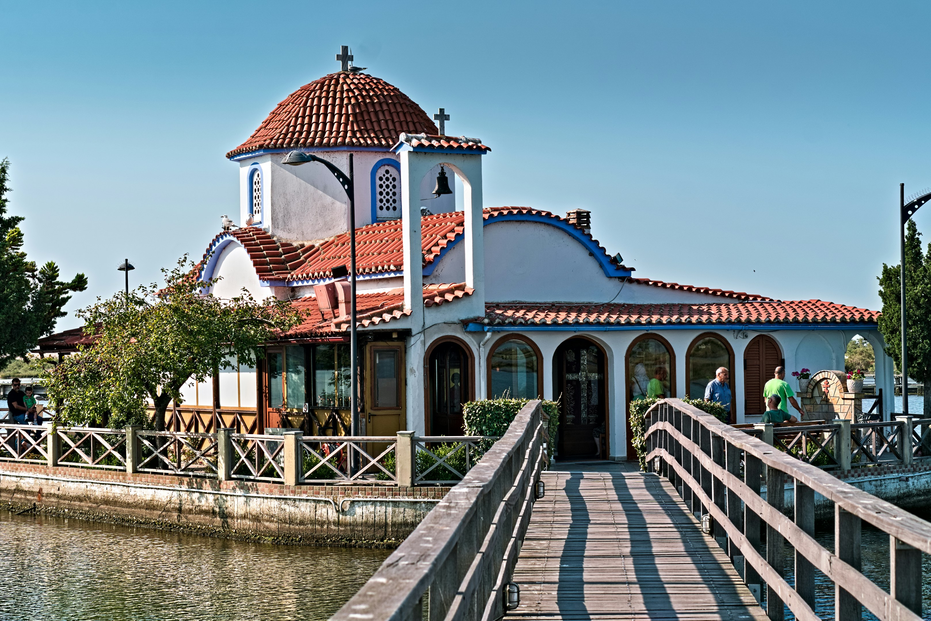 Azure-Domed Chapel by the Water: A Blue-Roofed Seaside Icon