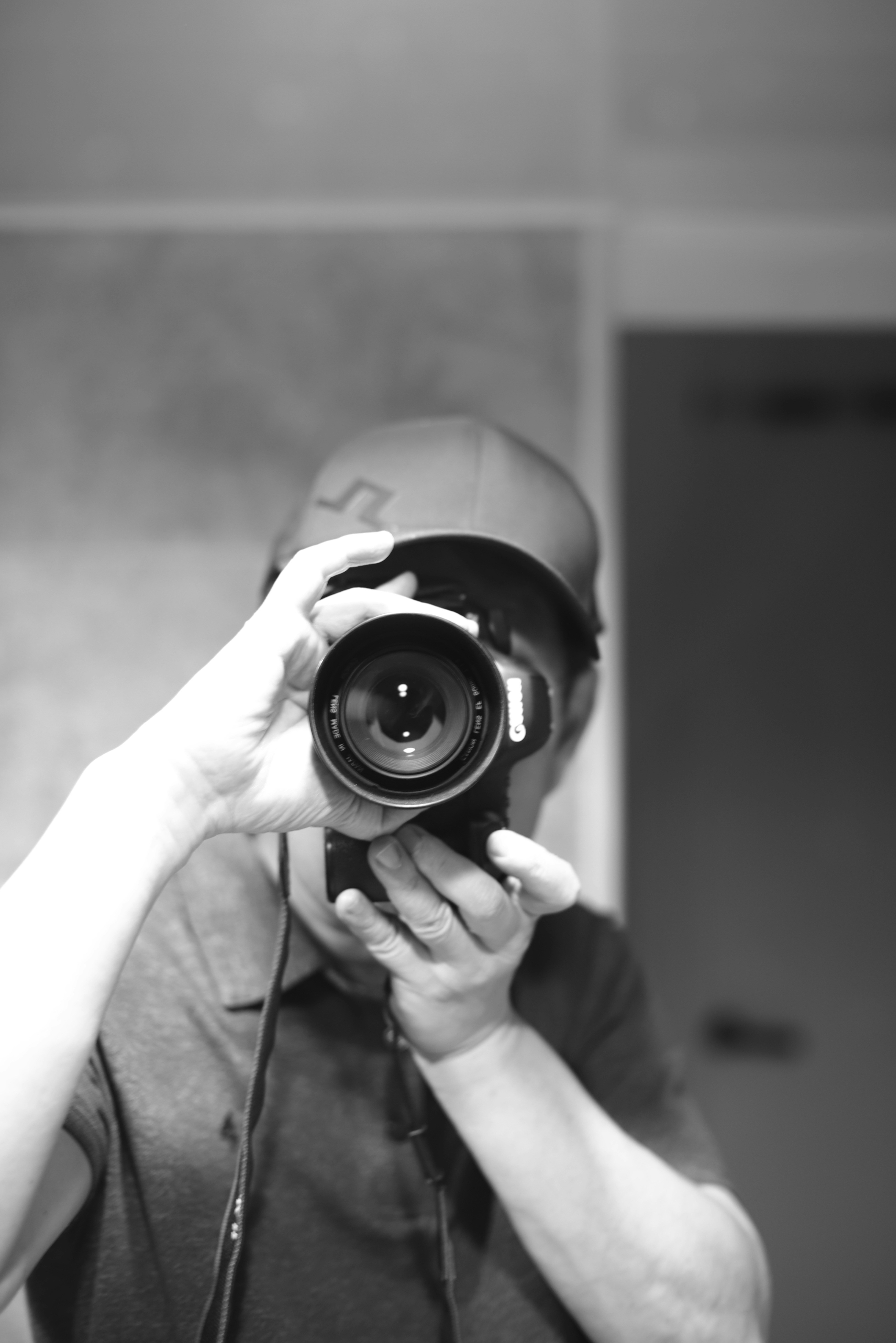 A person is taking a photo with a camera.