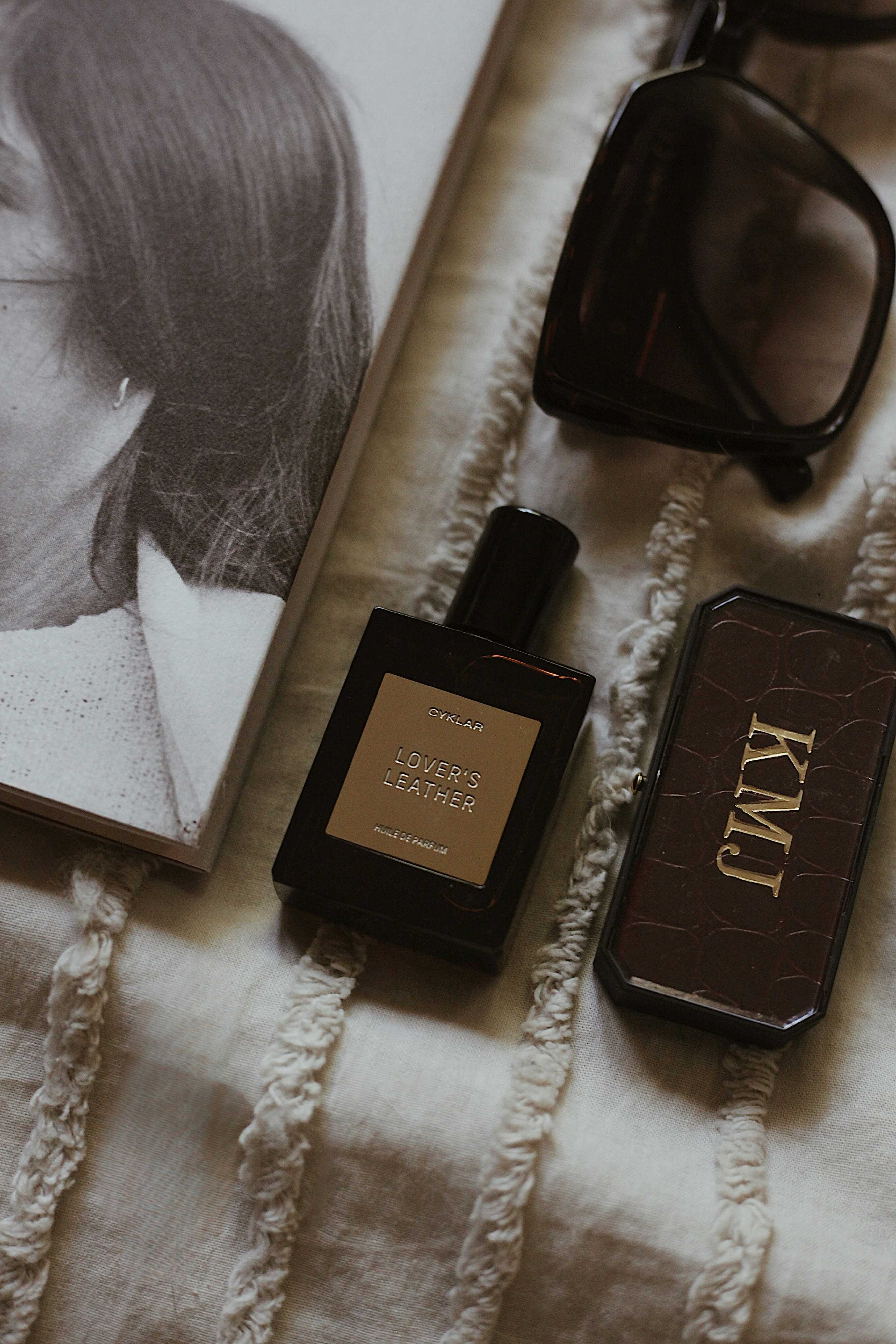 Processed with VSCO with a4 preset | Perfume, glasses, and a personalized case are featured.