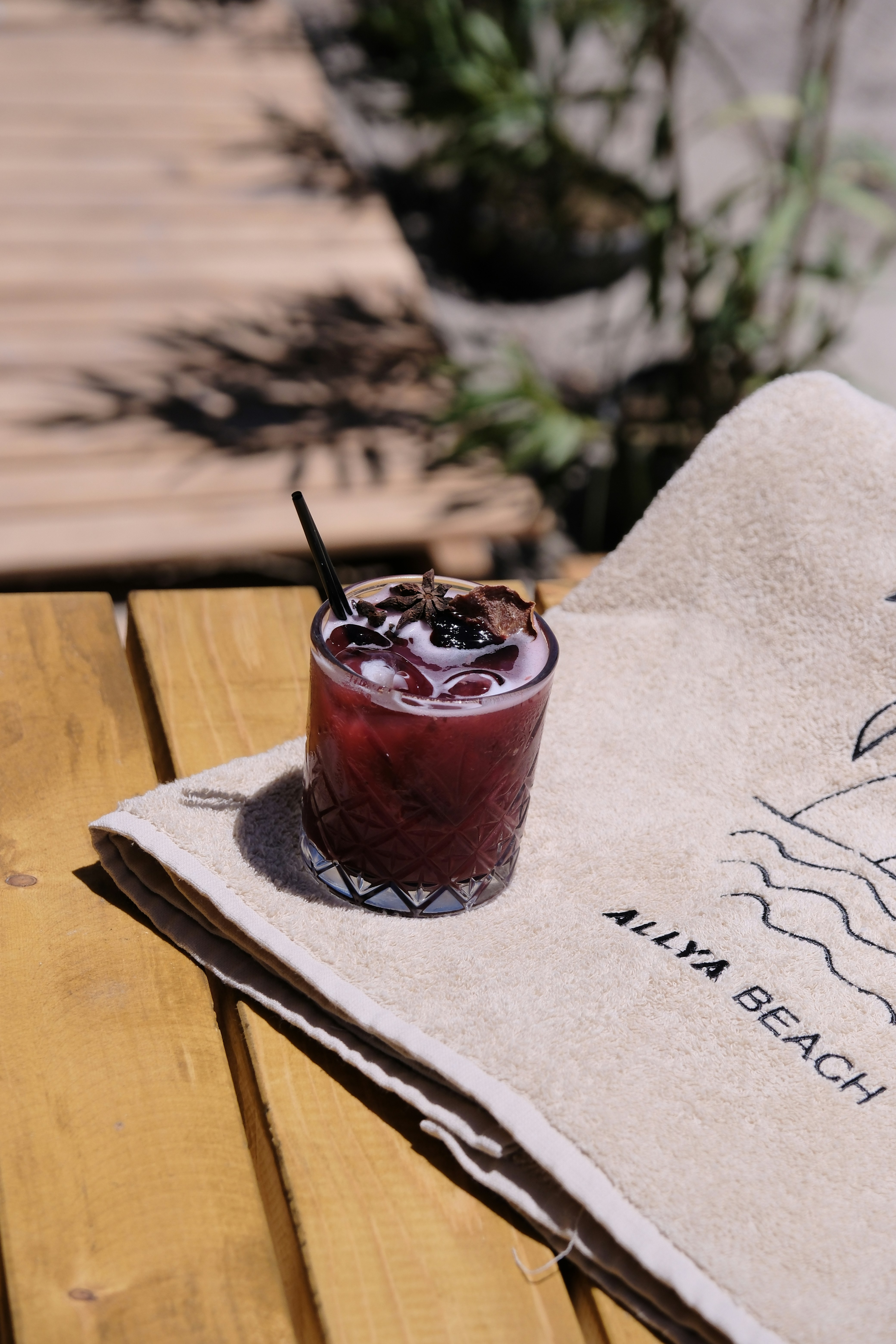 Crimson Cooler on a Sunlit Beach Deck